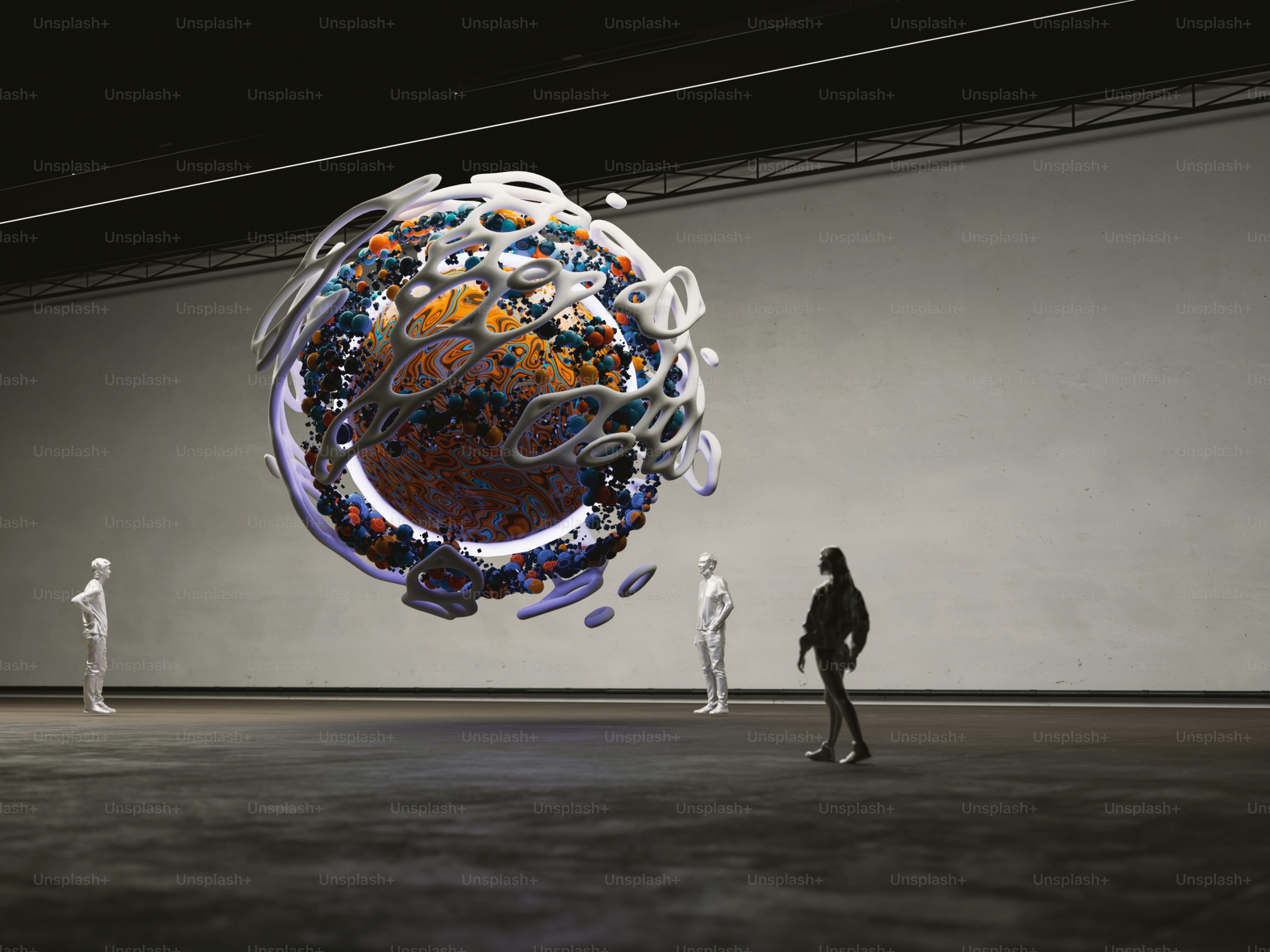 A group of people standing around a large object photo – People Image ...