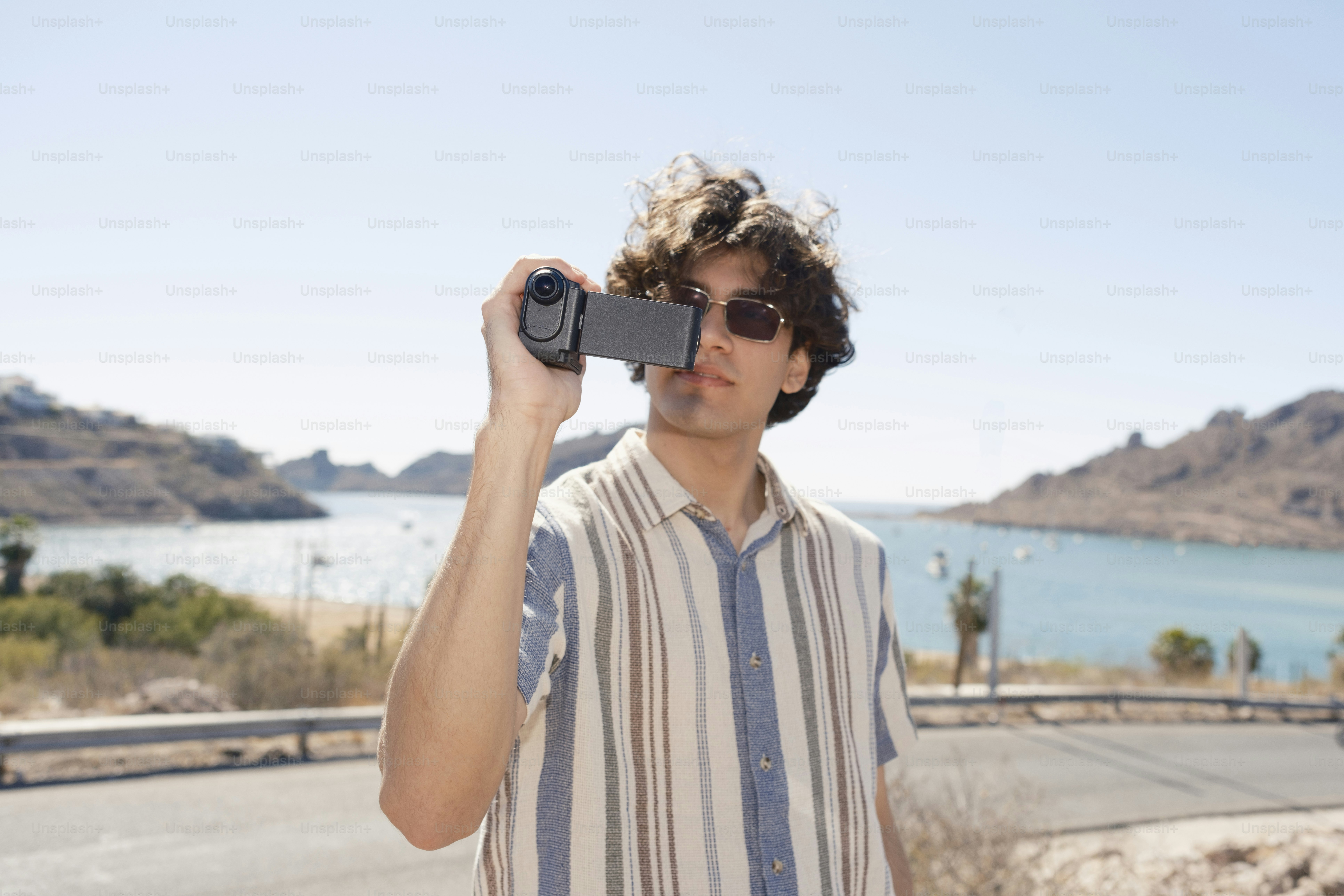 A man taking a picture of himself with a camera photo – Portrait Image ...