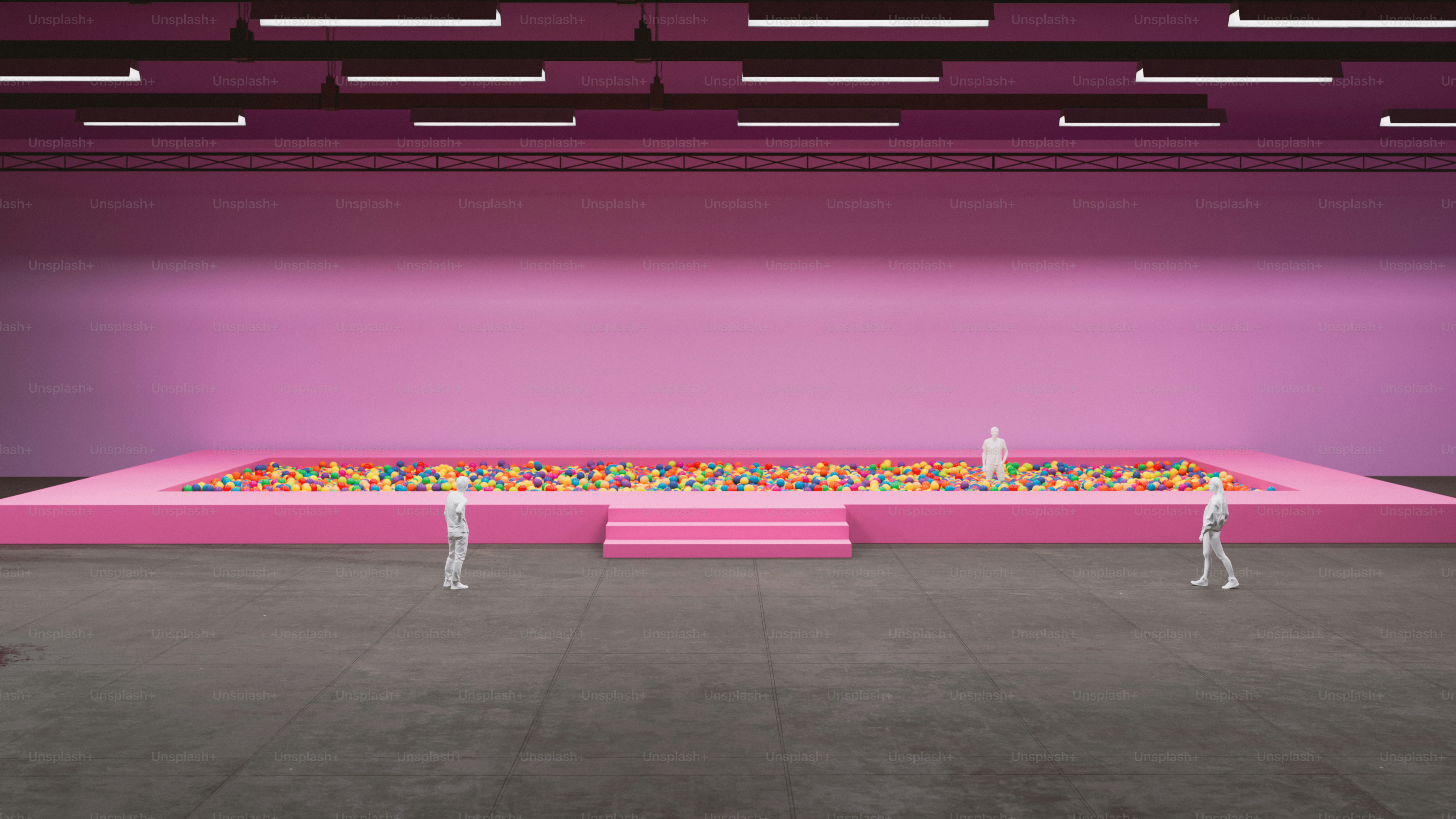 A room with a pink couch and two people walking on the floor photo ...