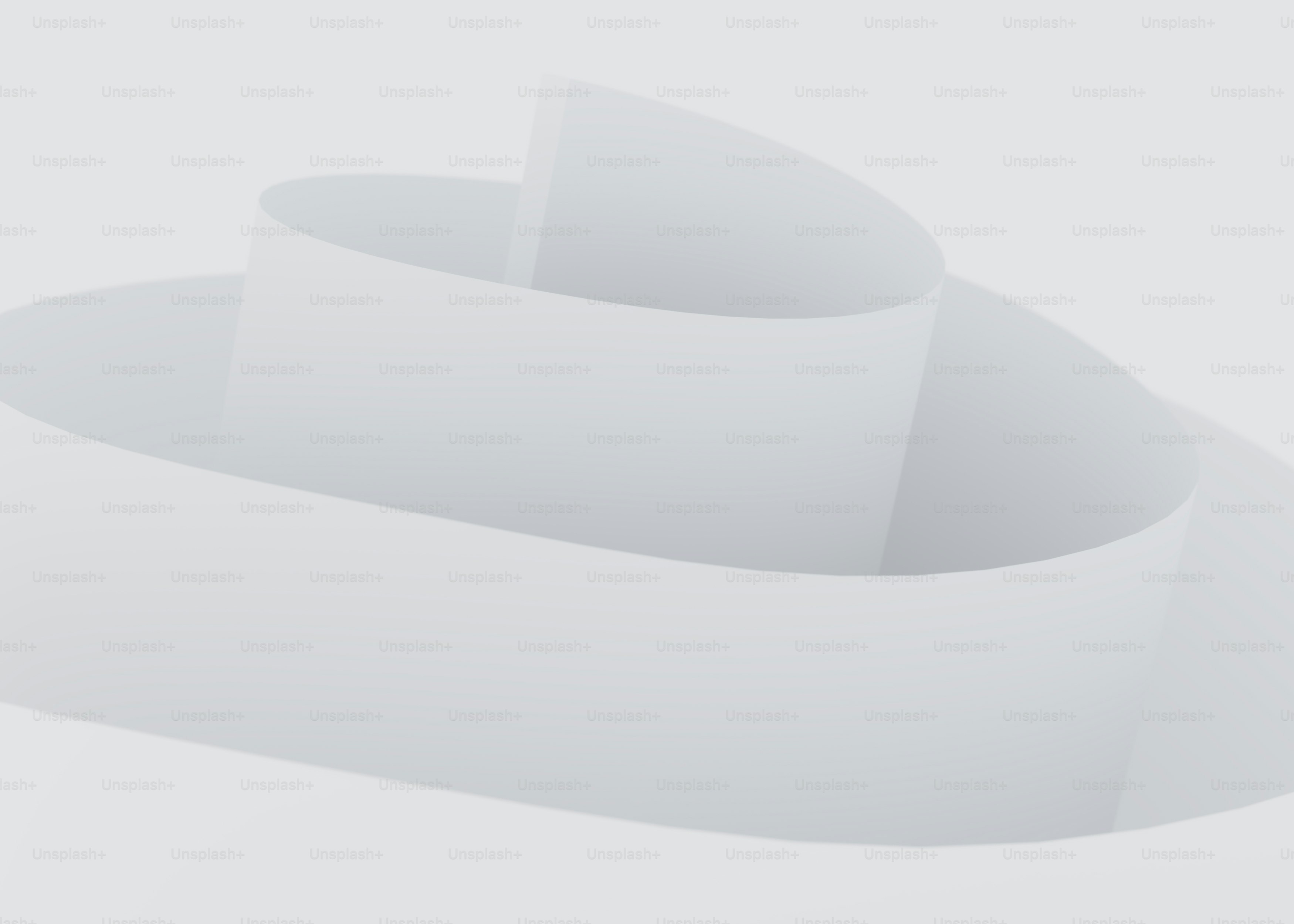 A close up of a curved object on a white background photo – Light ...