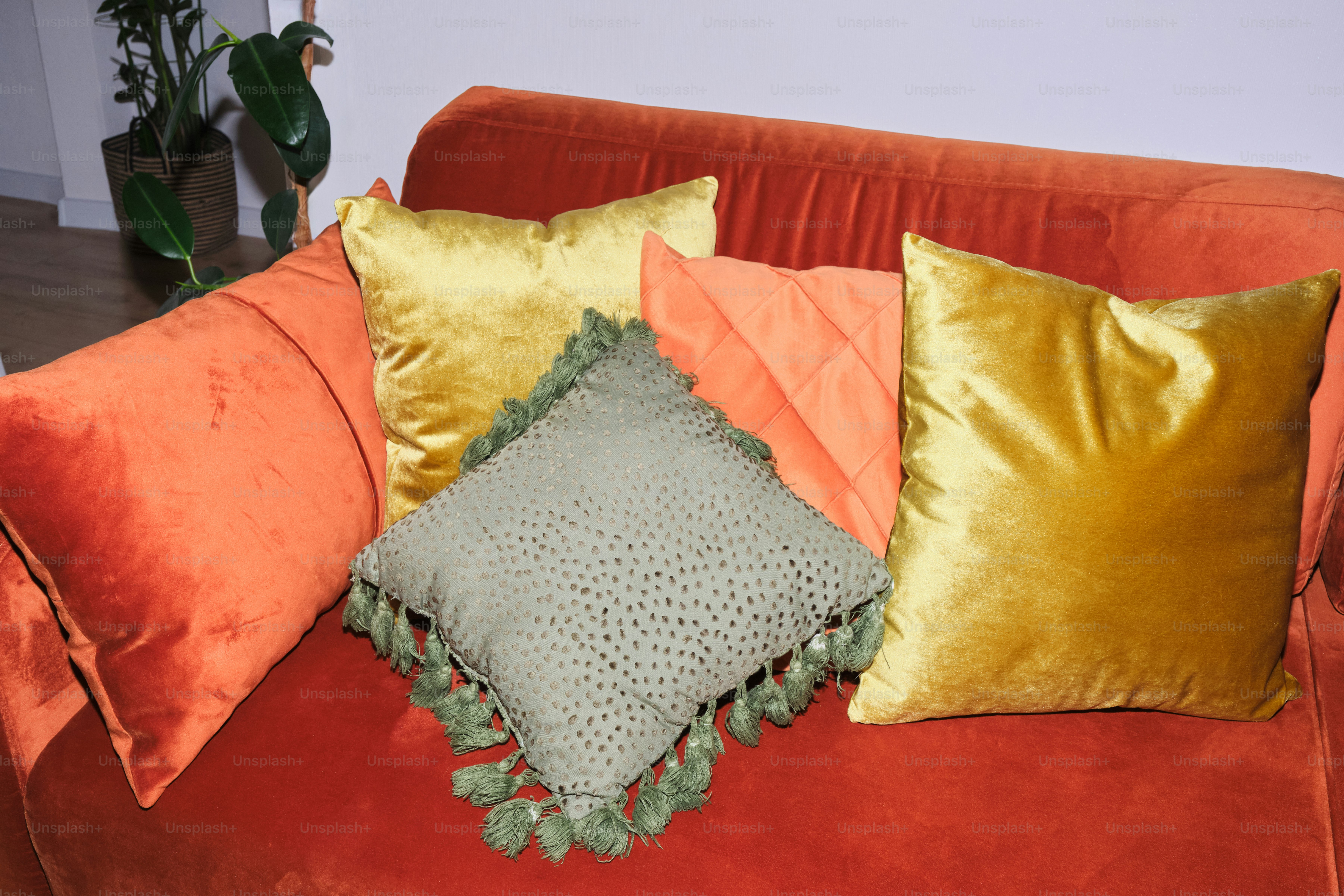 A couch with a bunch of pillows on top of it photo – Texture Image on ...