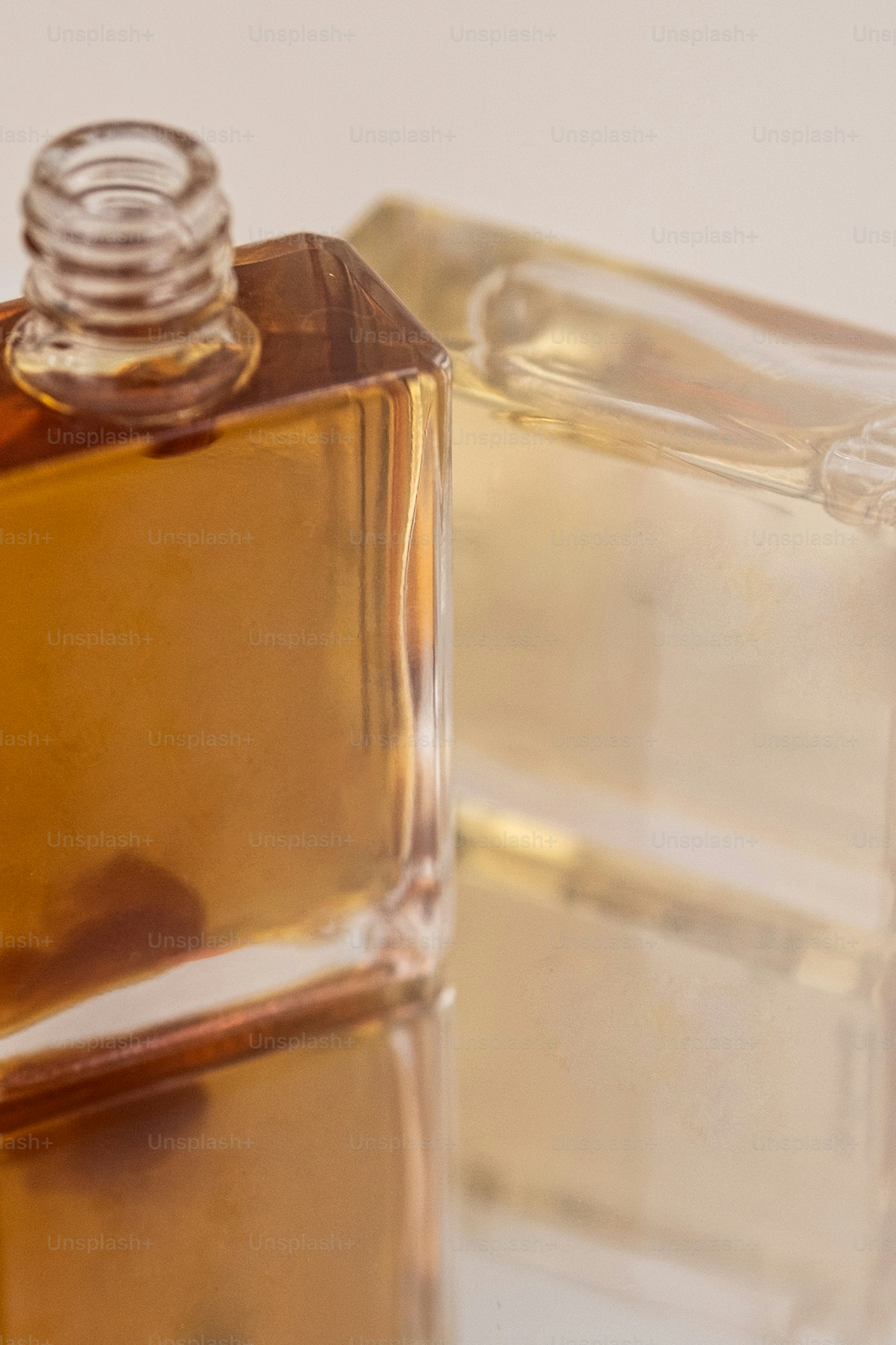 A bottle of perfume sitting on top of a table photo – Perfume Image on ...