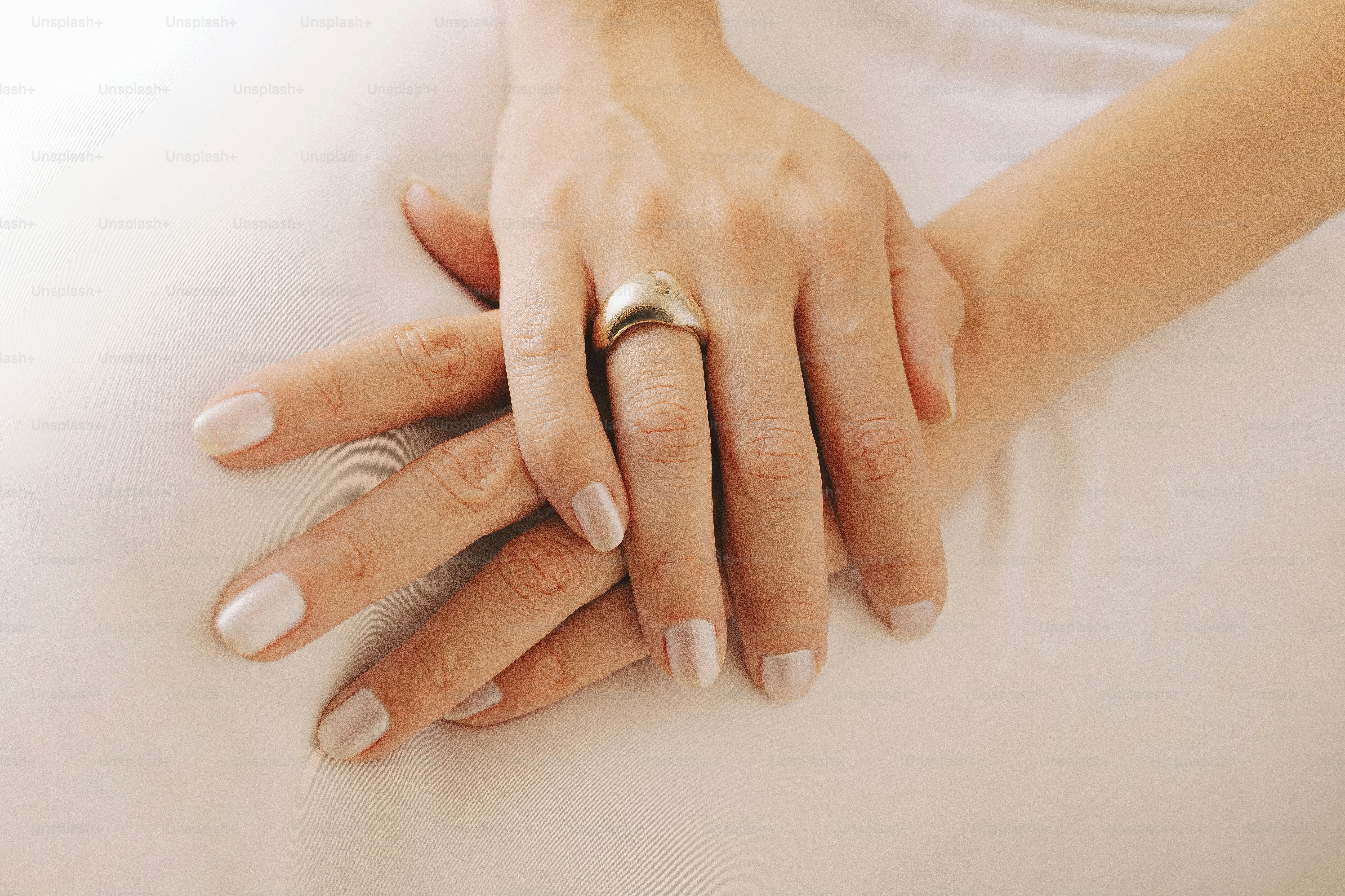 A woman's hands resting on a man's stomach photo – Minimal Image on ...