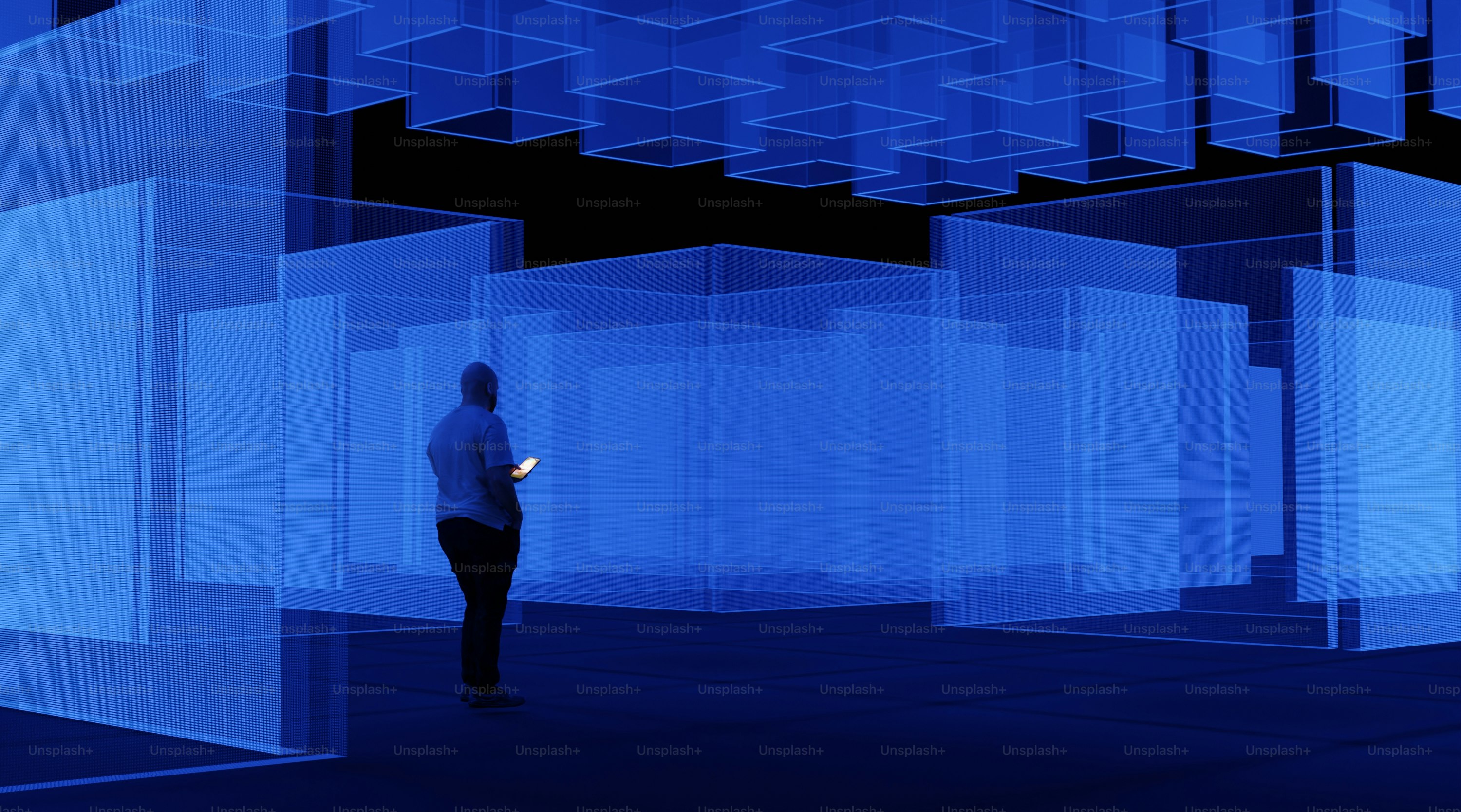 A person standing in a room with blue walls photo – Museum Image on ...