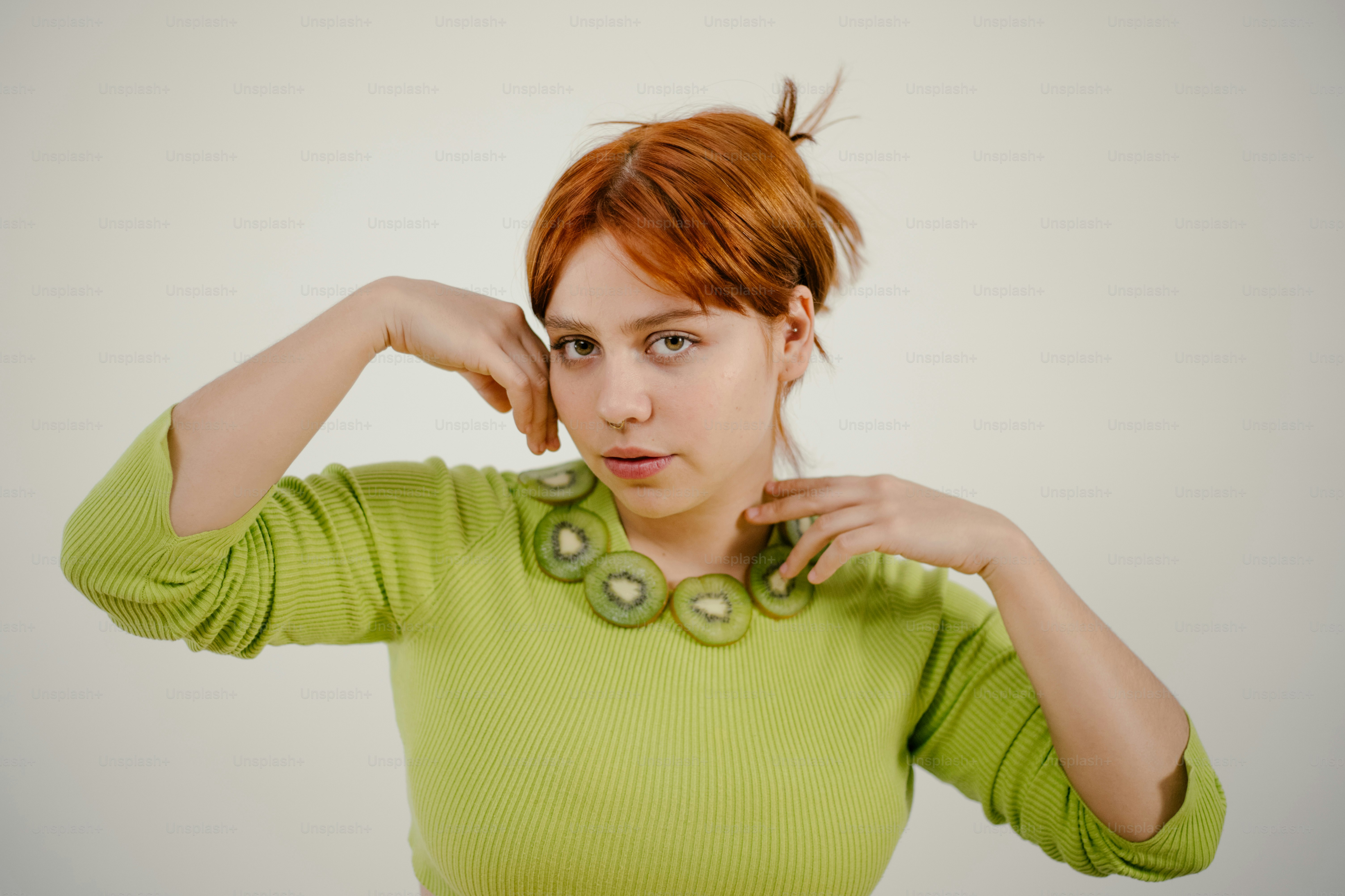 A woman in a green shirt is posing for a picture photo – Playing Image ...