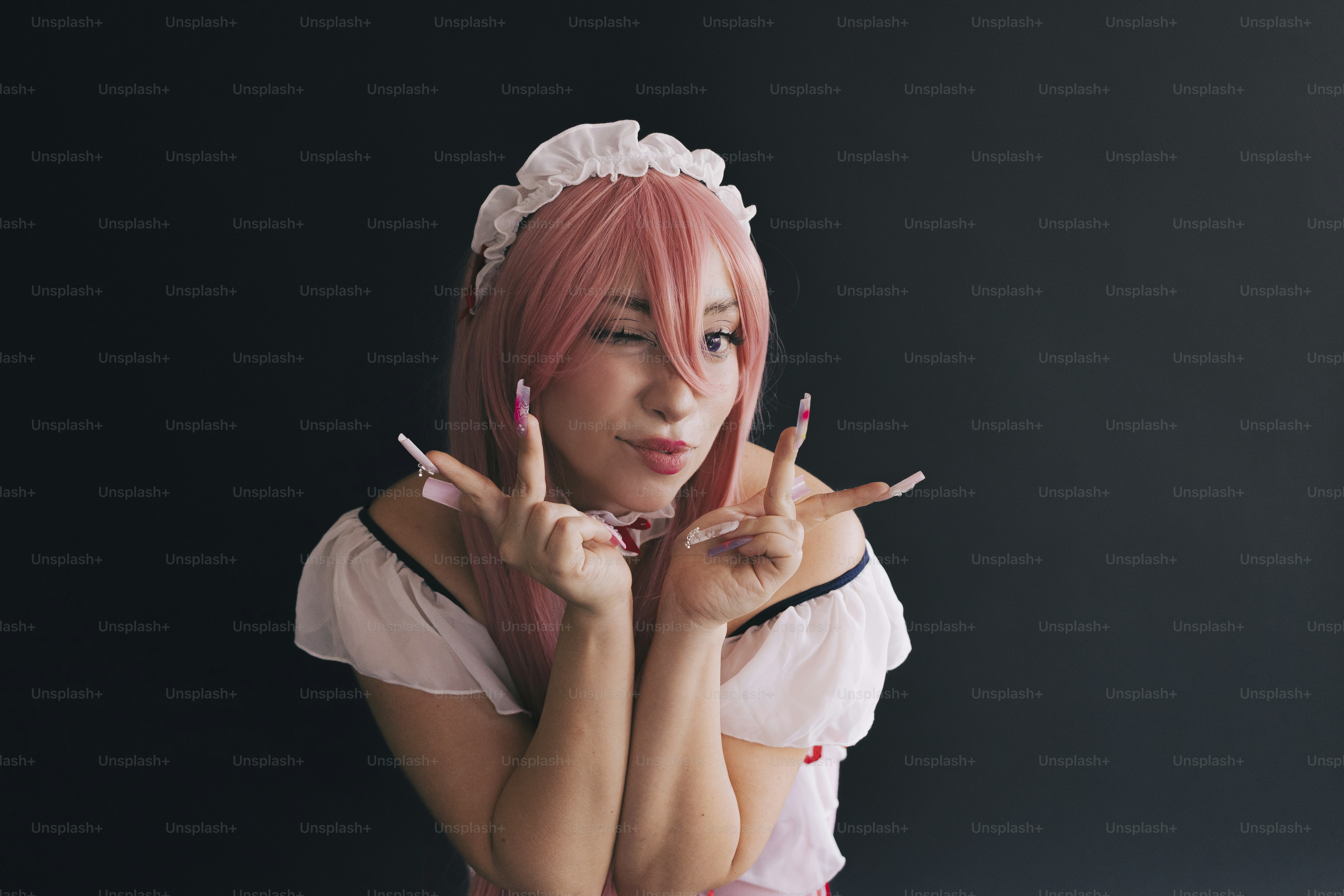 Woman poses in cosplay with peace signs. photo – Character Image on ...