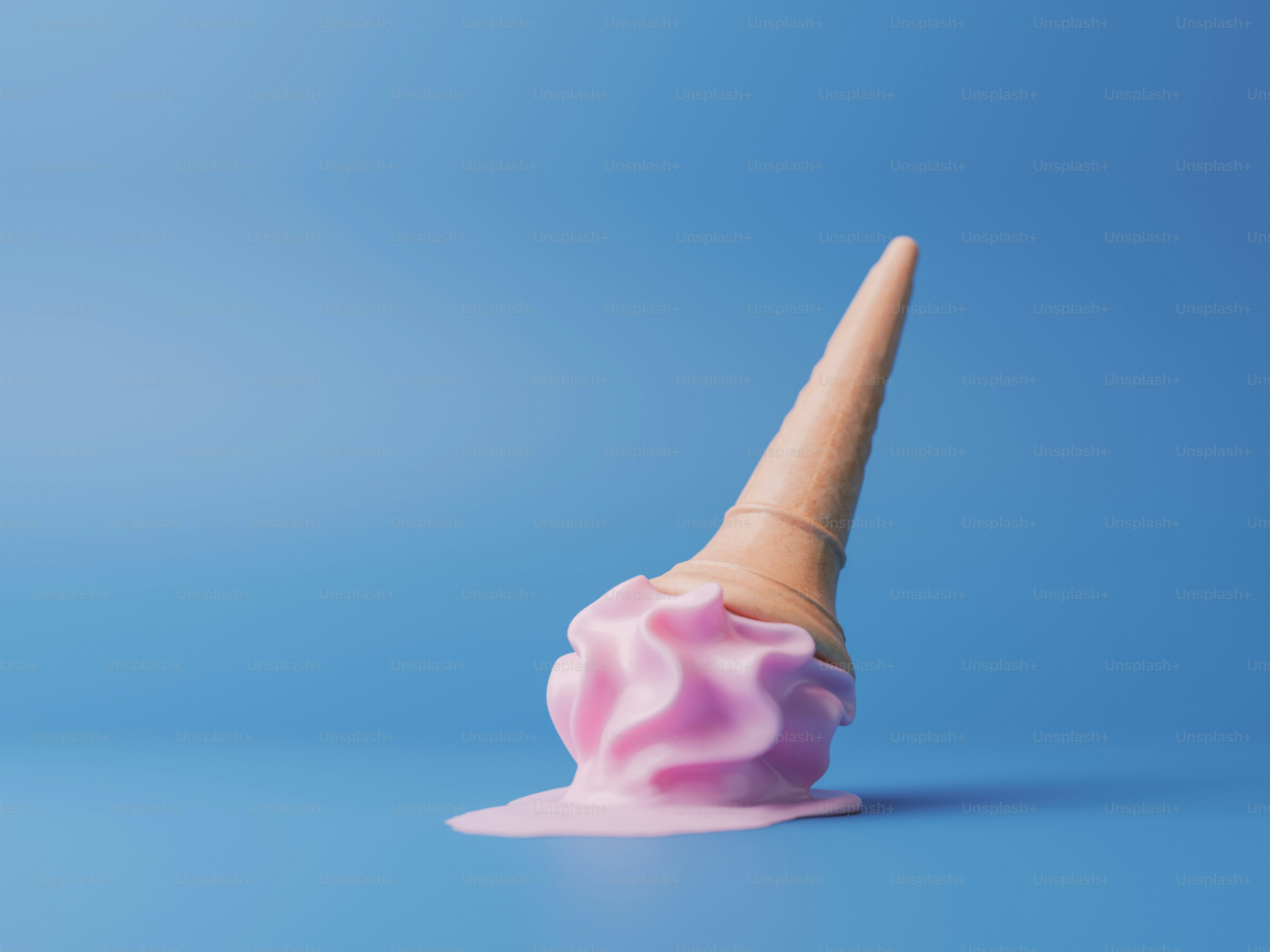 An ice cream cone has fallen over and melted. photo – Ice cream Image ...