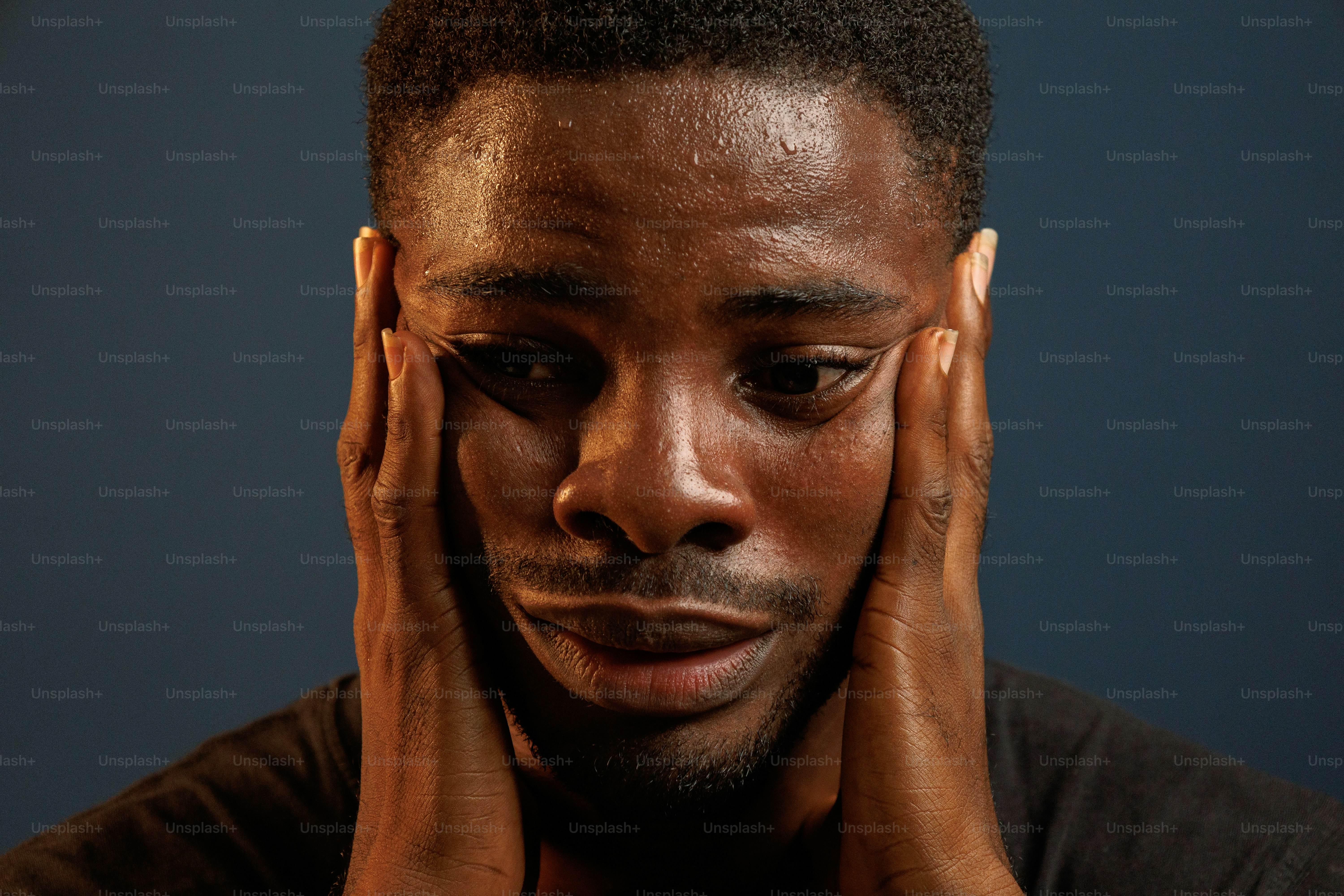 A man looking sad with his hands on his face. photo – Sad Image on Unsplash