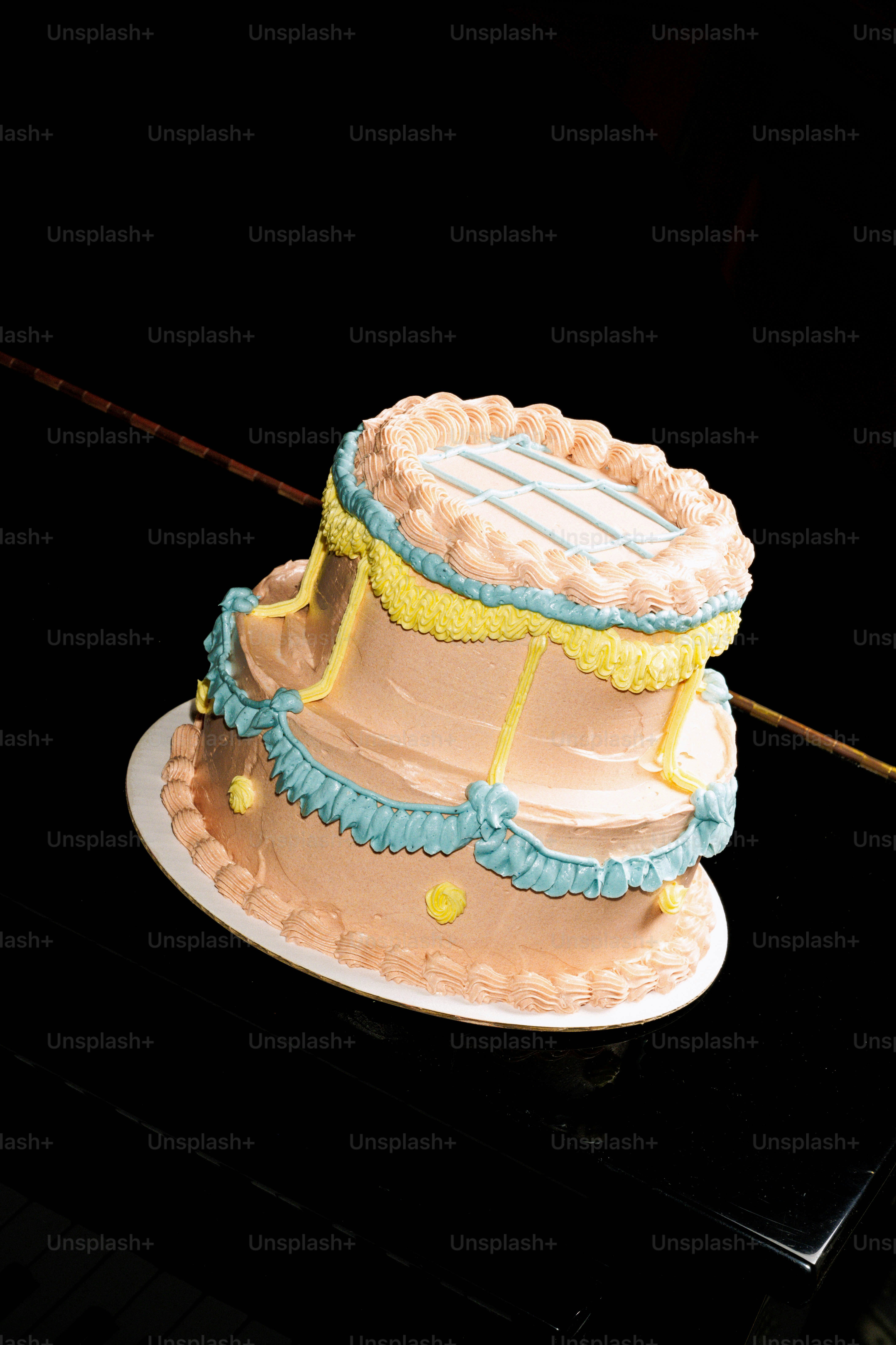 Cakes of various sizes and colors sit on stairs. photo – Cake Image on ...