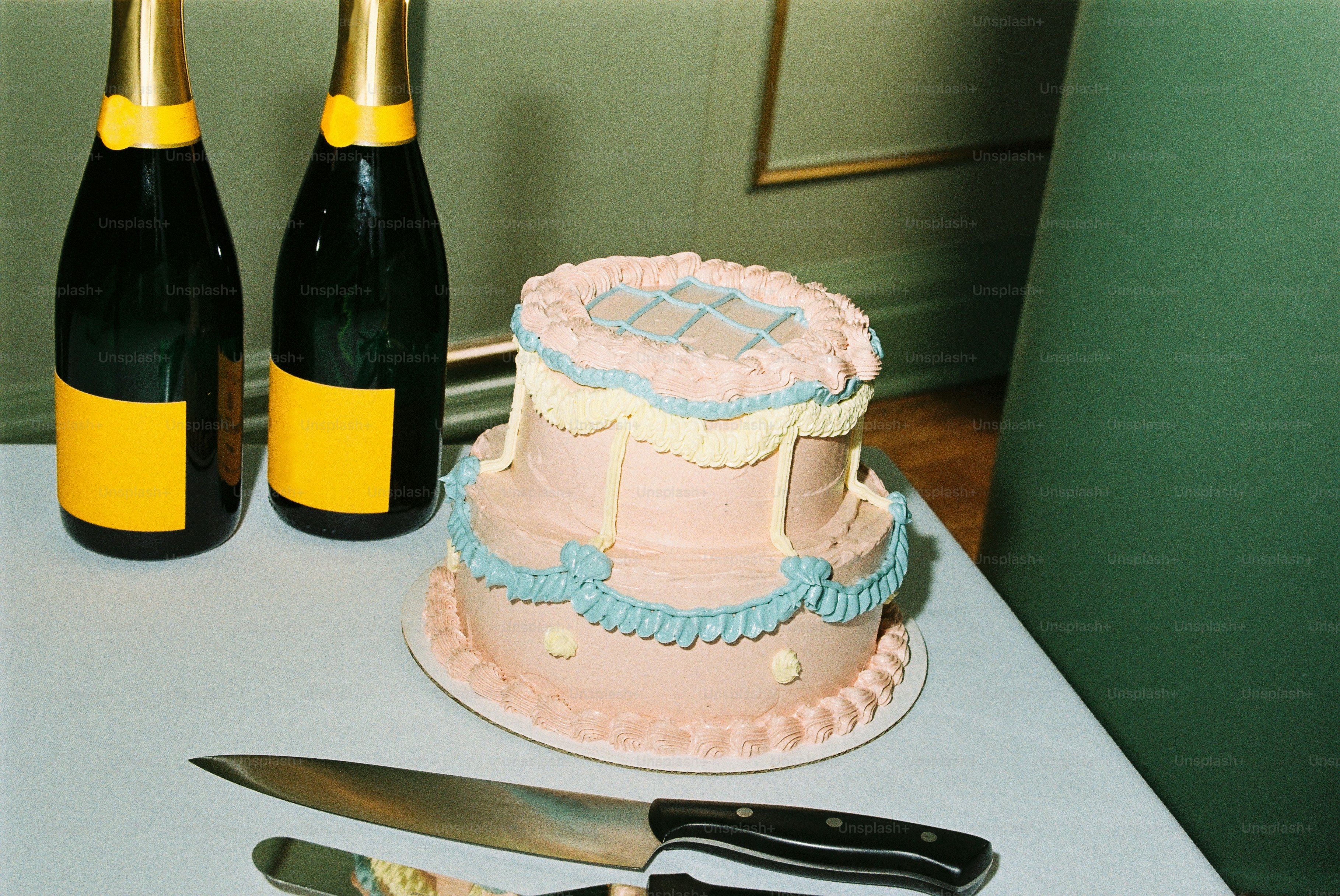 A two-tiered cake adorned with cherries. photo – Cake Image on Unsplash