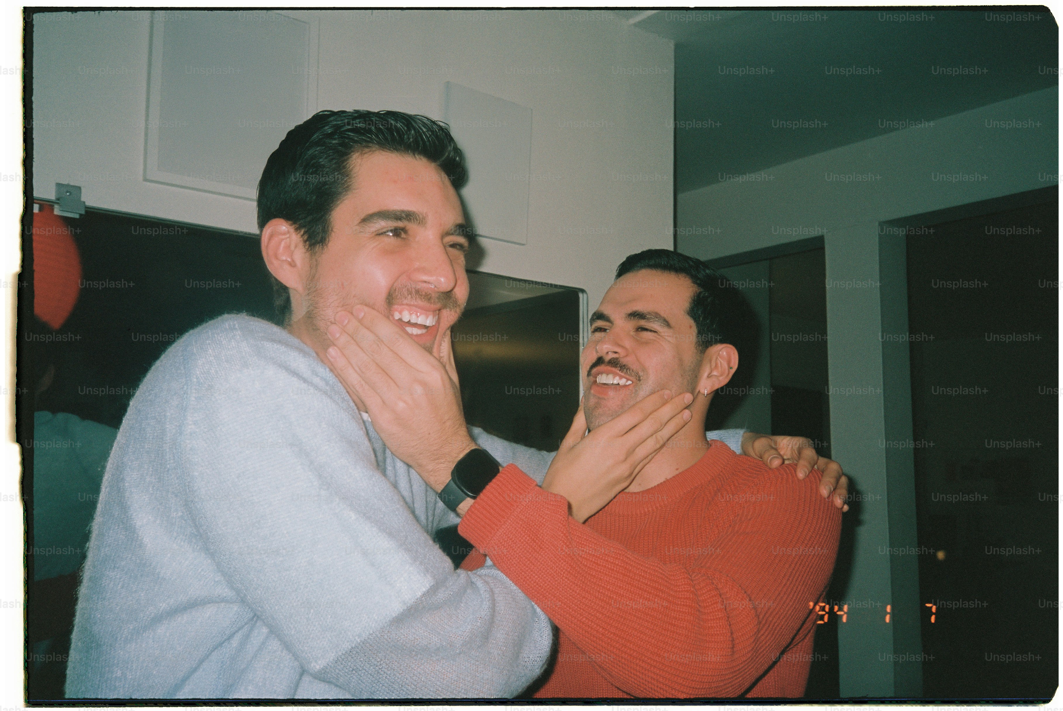 Two men are playfully interacting and laughing. photo – Love Image on ...