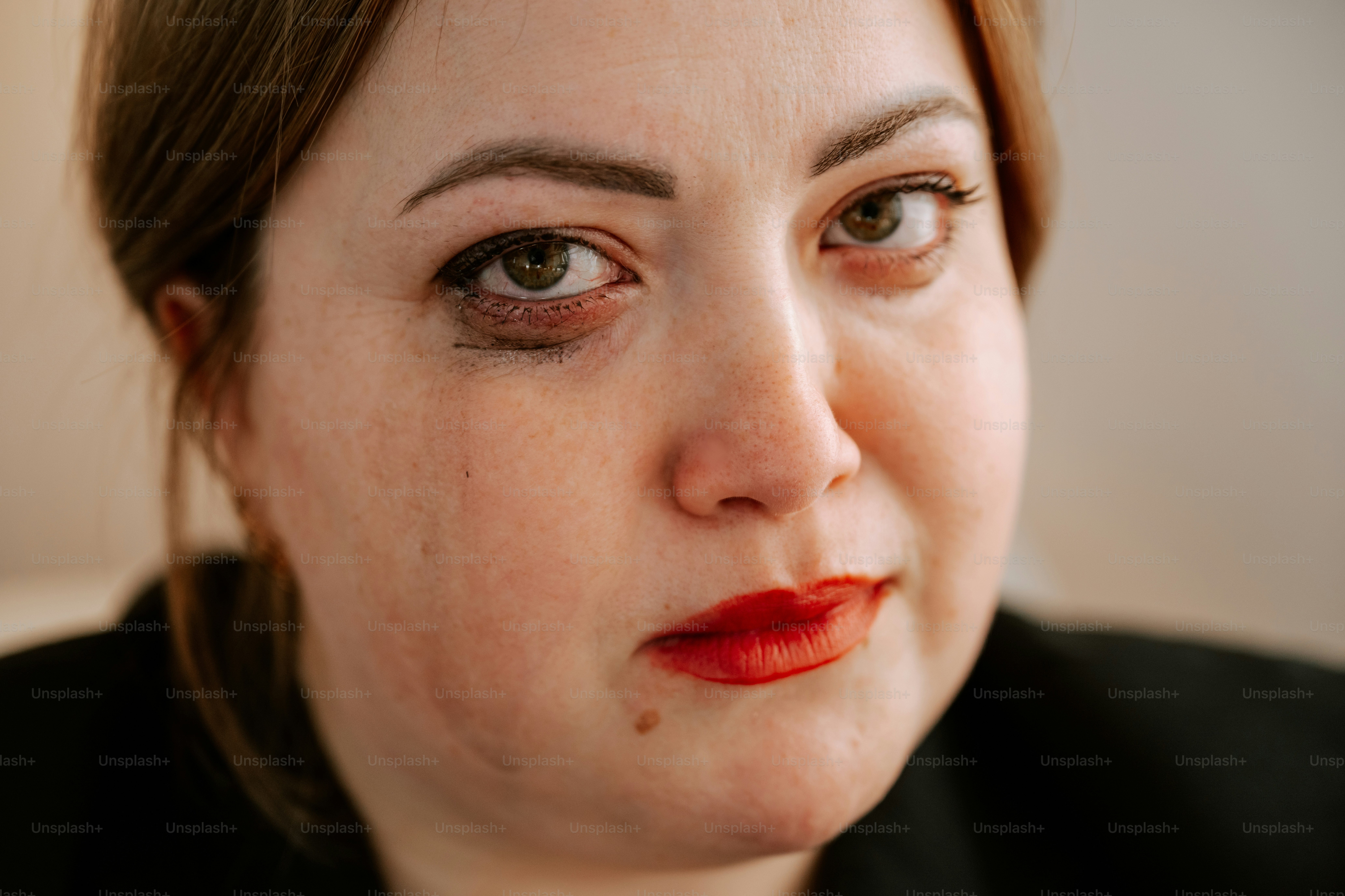 Woman is crying, with smeared makeup. photo – Sadness Image on Unsplash