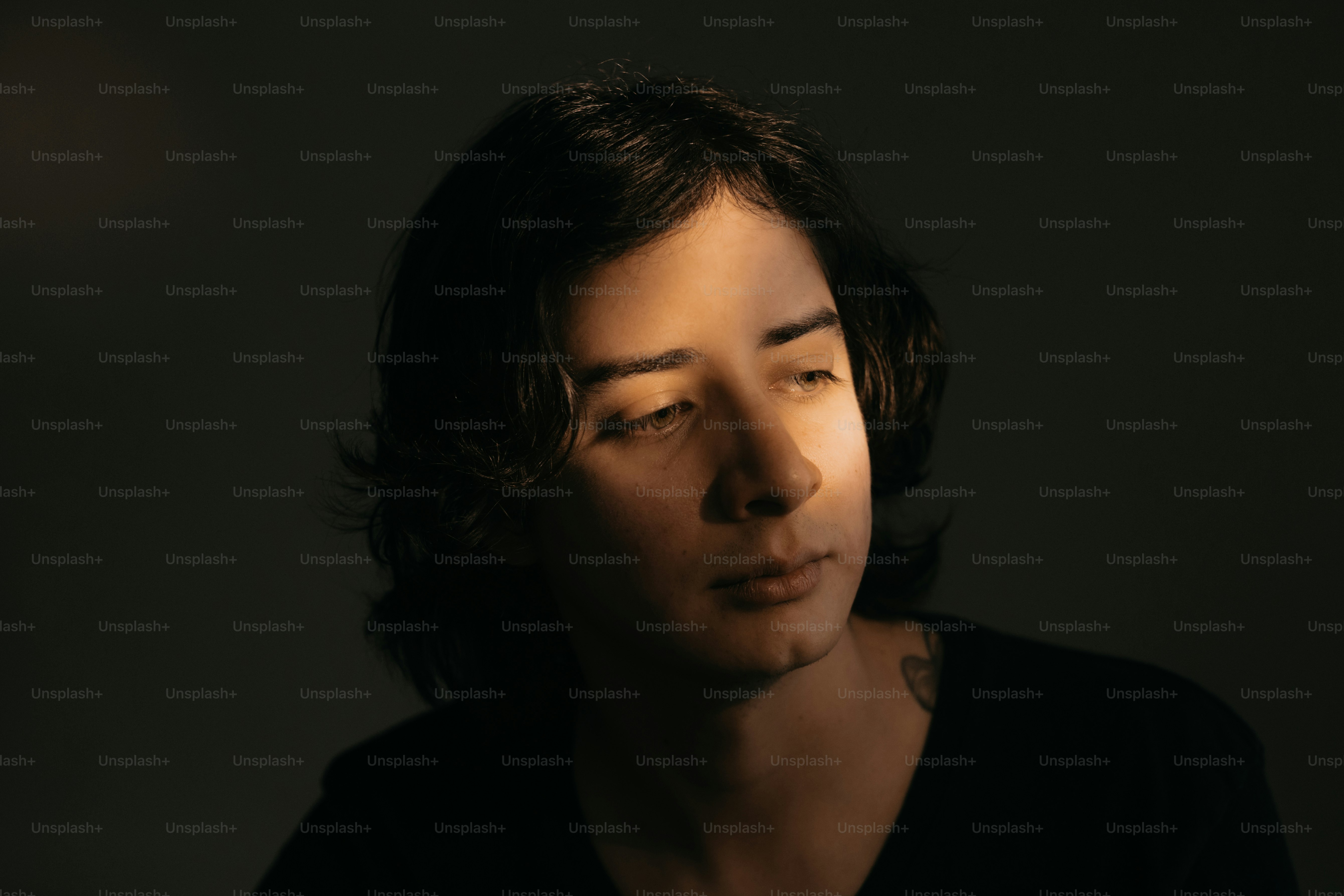 A person is illuminated by a dramatic light. photo – Portrait Image on ...
