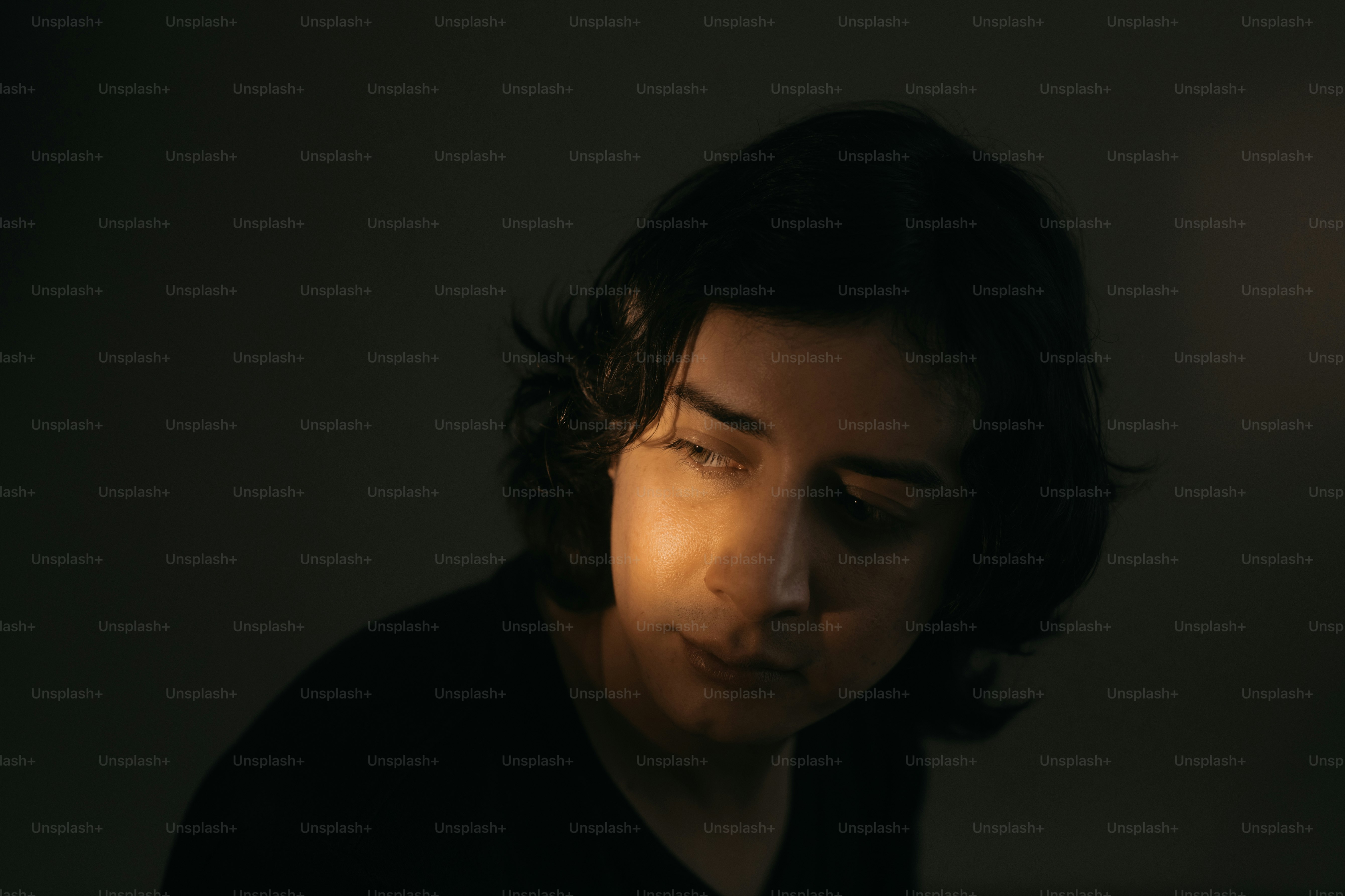 A person is illuminated by a single light. photo – Portrait Image on ...