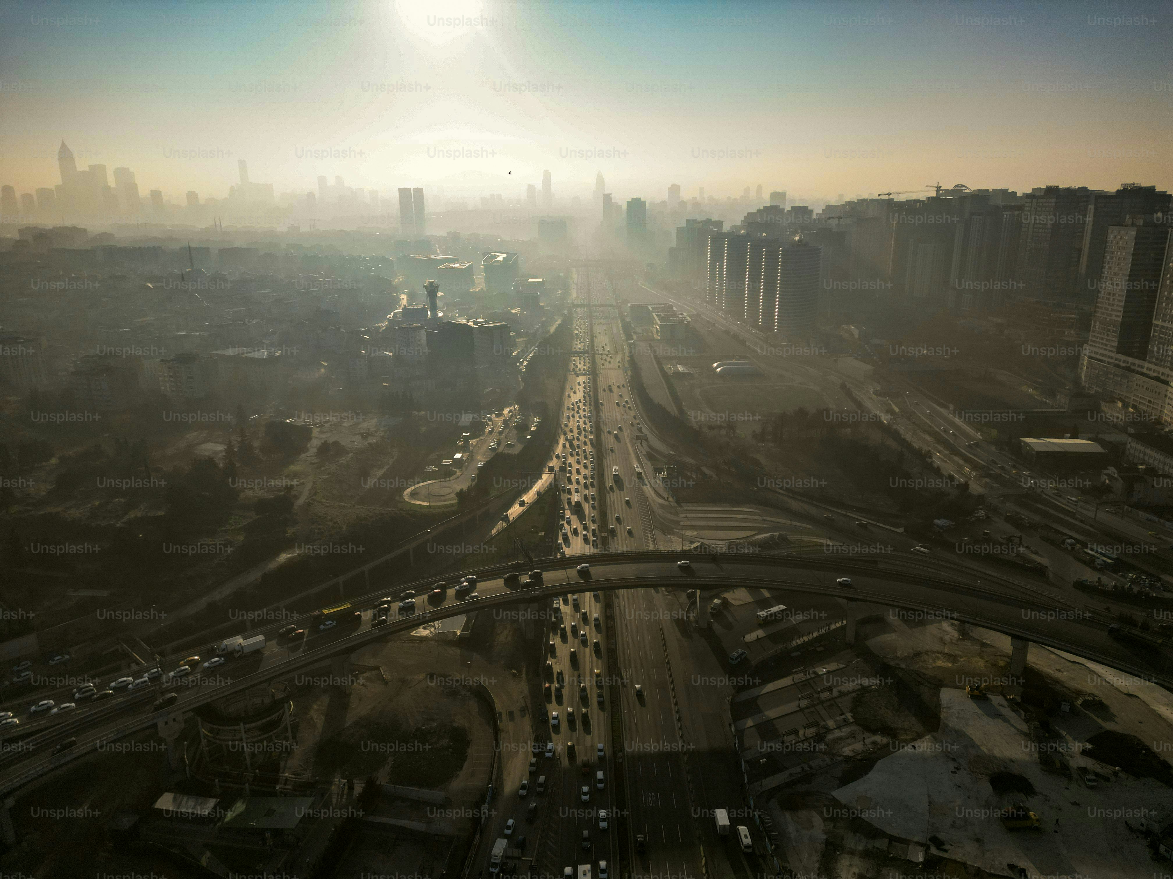 Cityscape shrouded in smog on a sunny day. photo – Traffic Image on ...