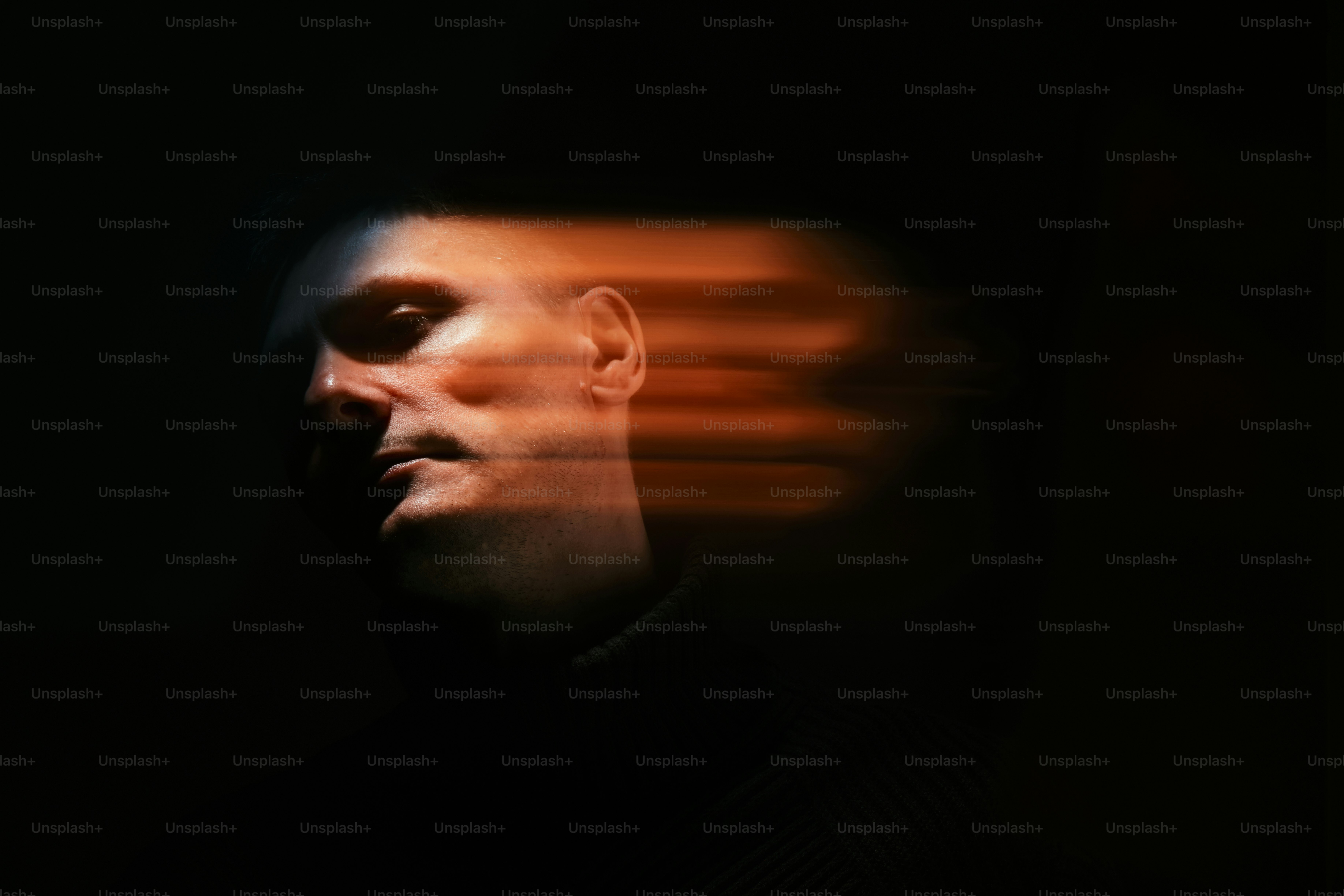 A man's face illuminated against darkness. photo – Portrait Image on ...