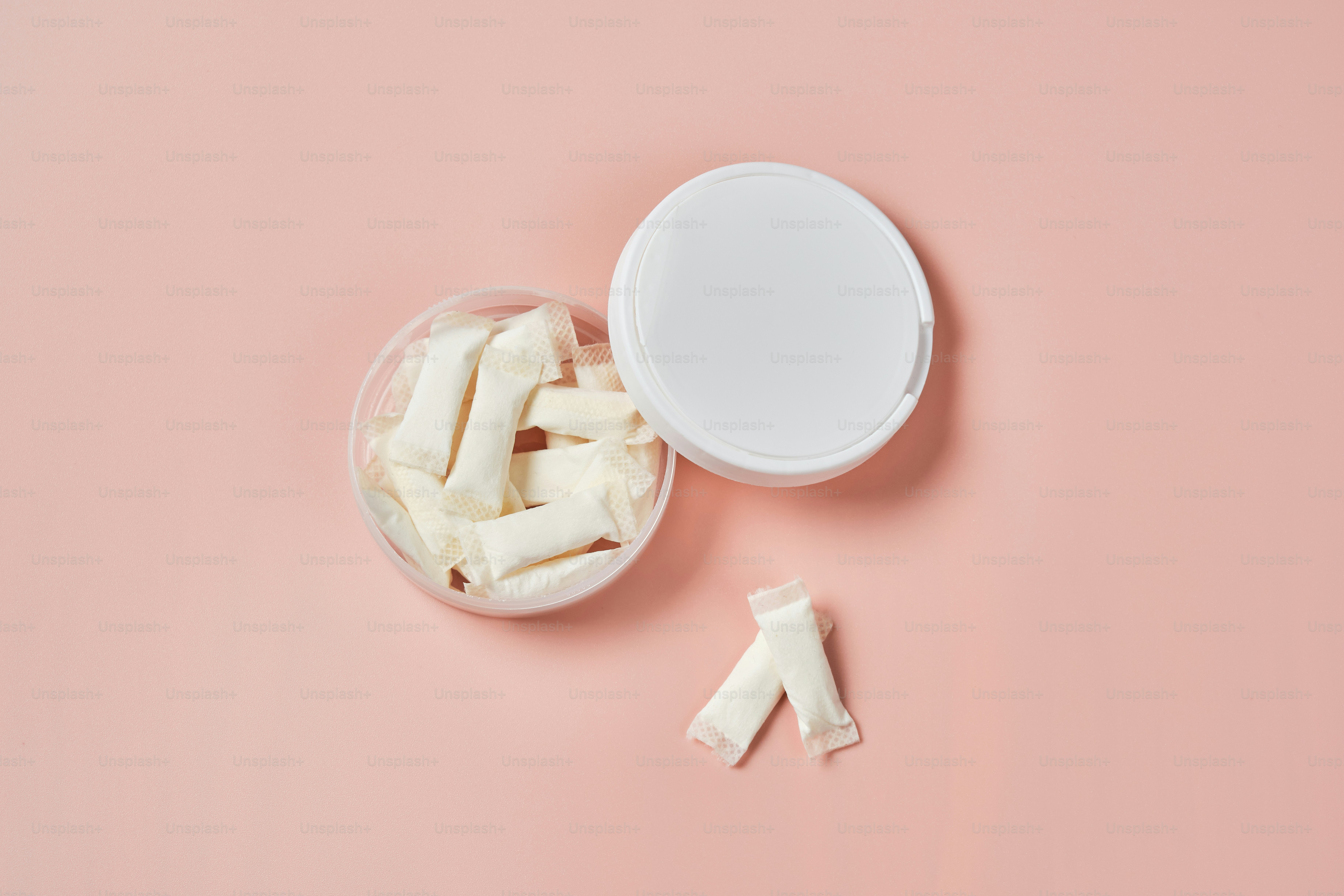 Nicotine pouches are shown inside a container. photo – Snus Image on ...