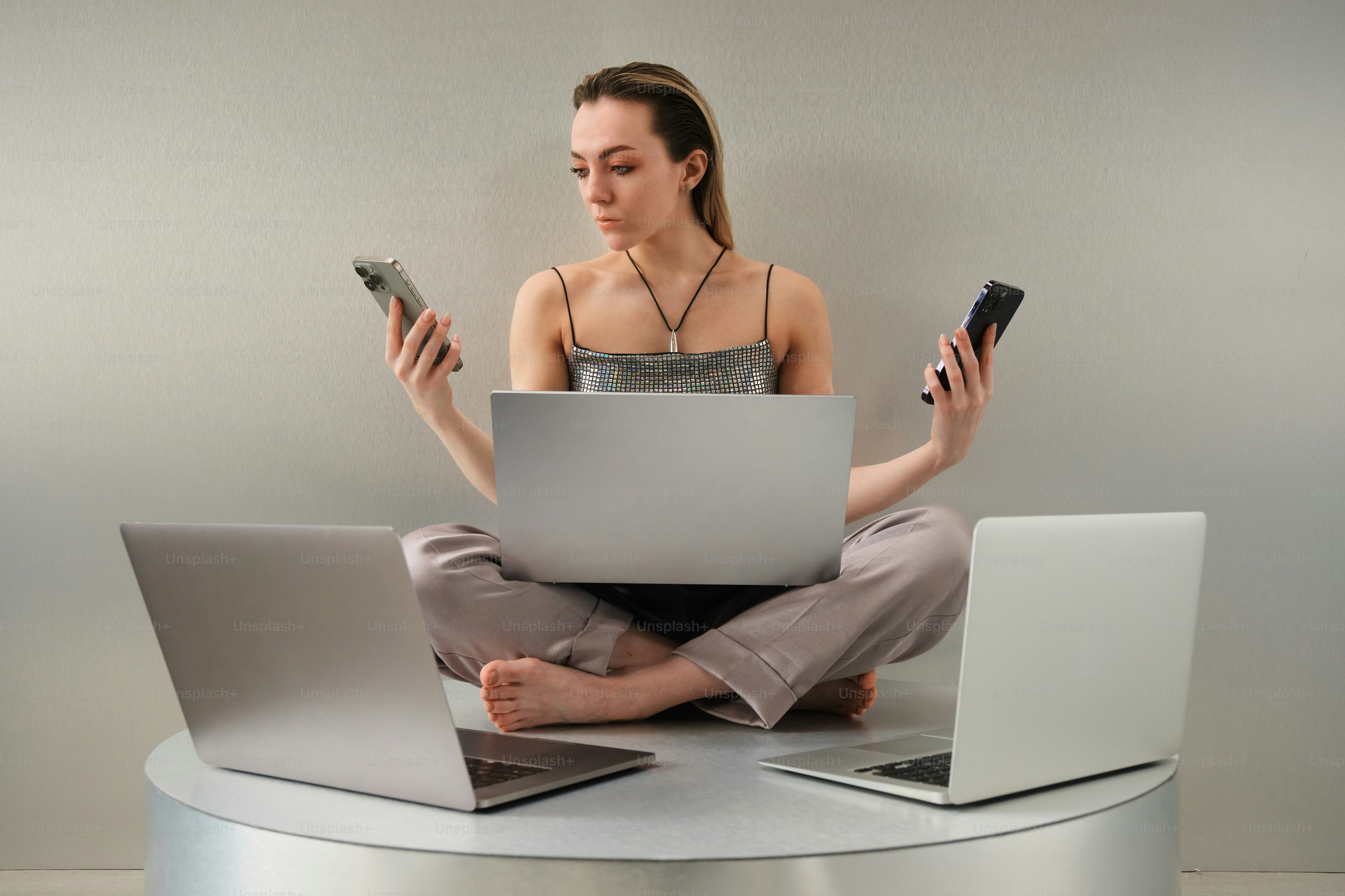 Woman uses multiple devices simultaneously. photo – Technology Image on ...