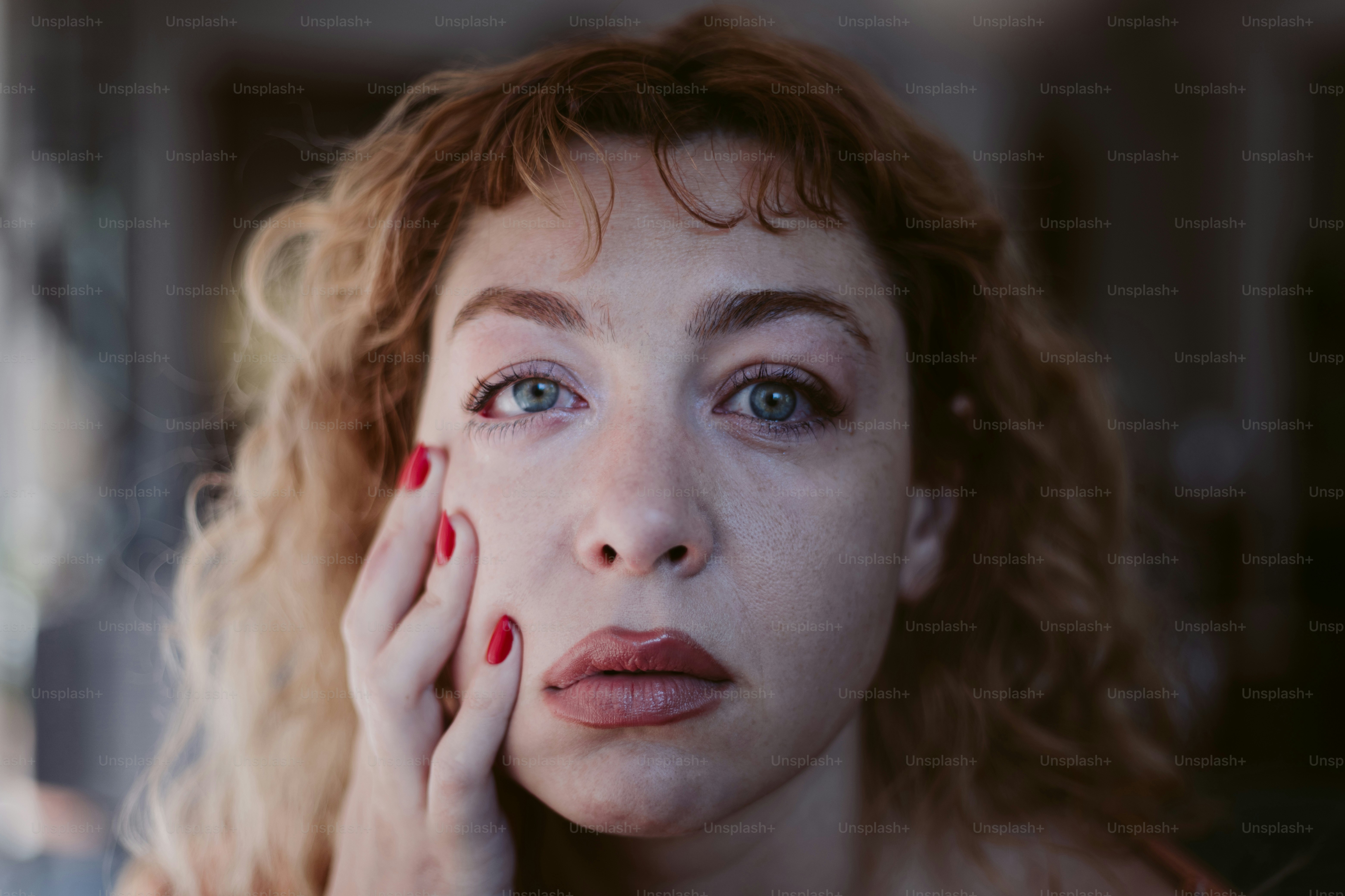 A woman looks sadly at the camera. photo – Crying Image on Unsplash