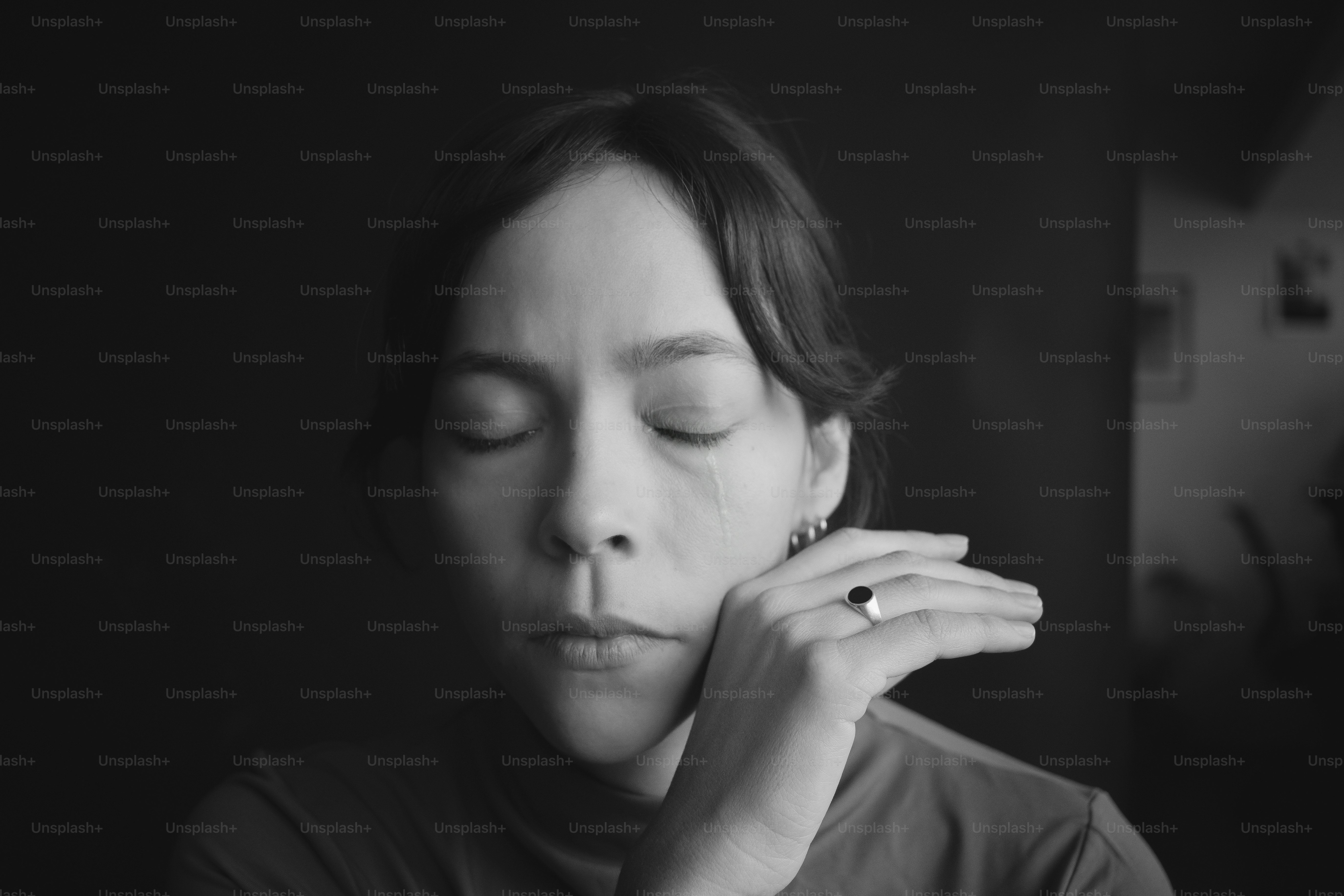 Woman appears to be wiping a tear. photo – Mental health Image on Unsplash