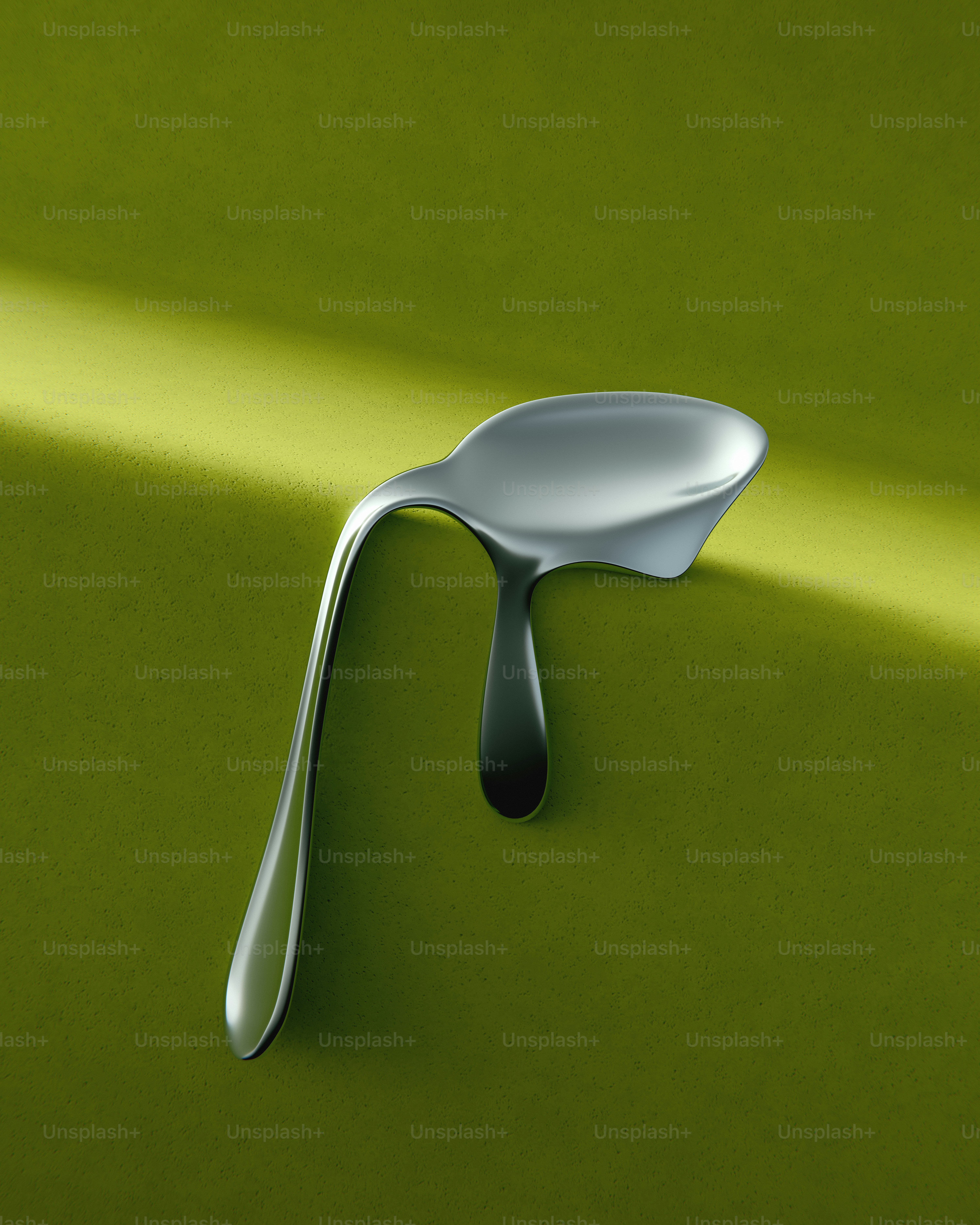 A melting spoon rests on a green backdrop. photo – 3d render Image on ...