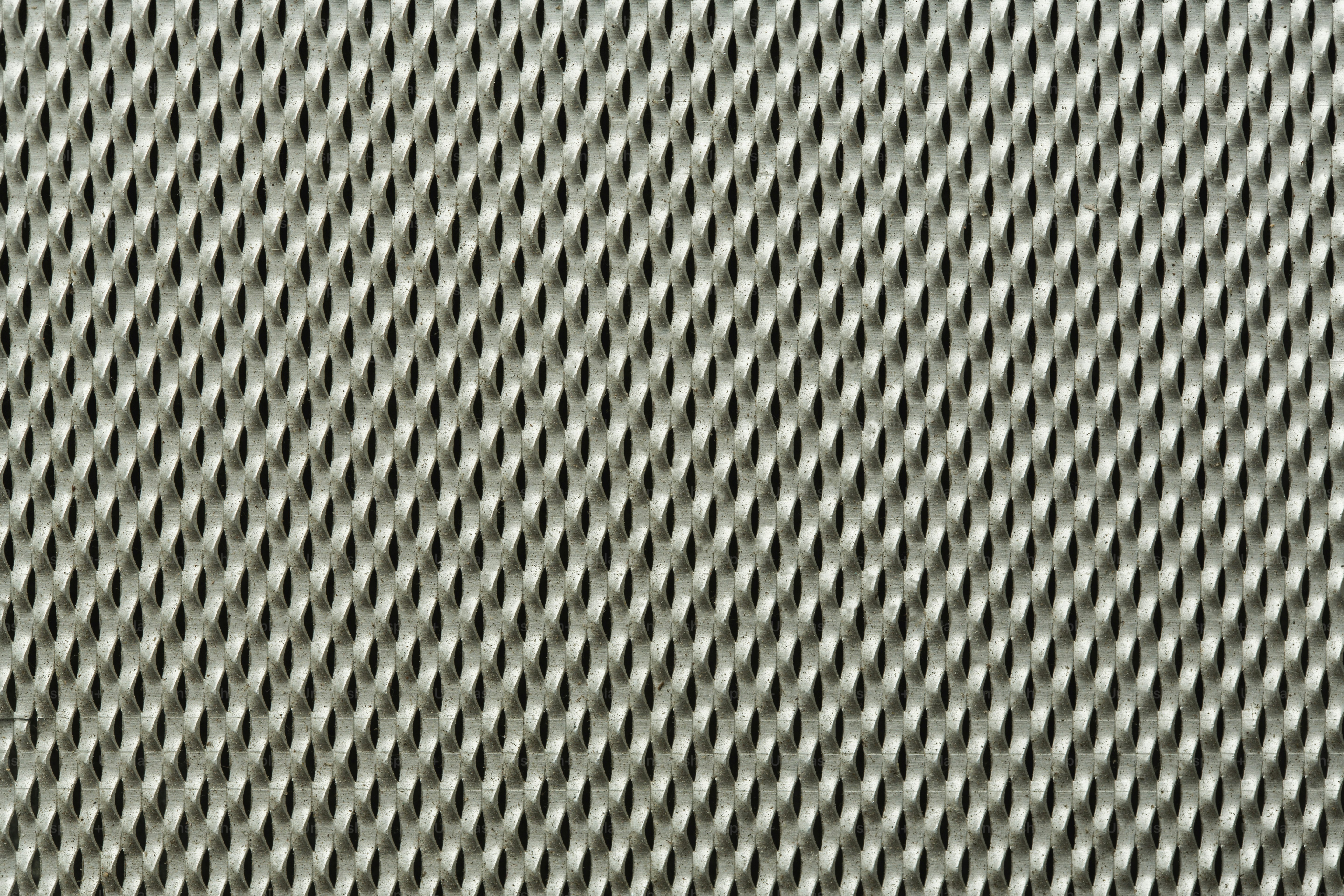 A detailed close-up of metal mesh. photo – Texture Image on Unsplash