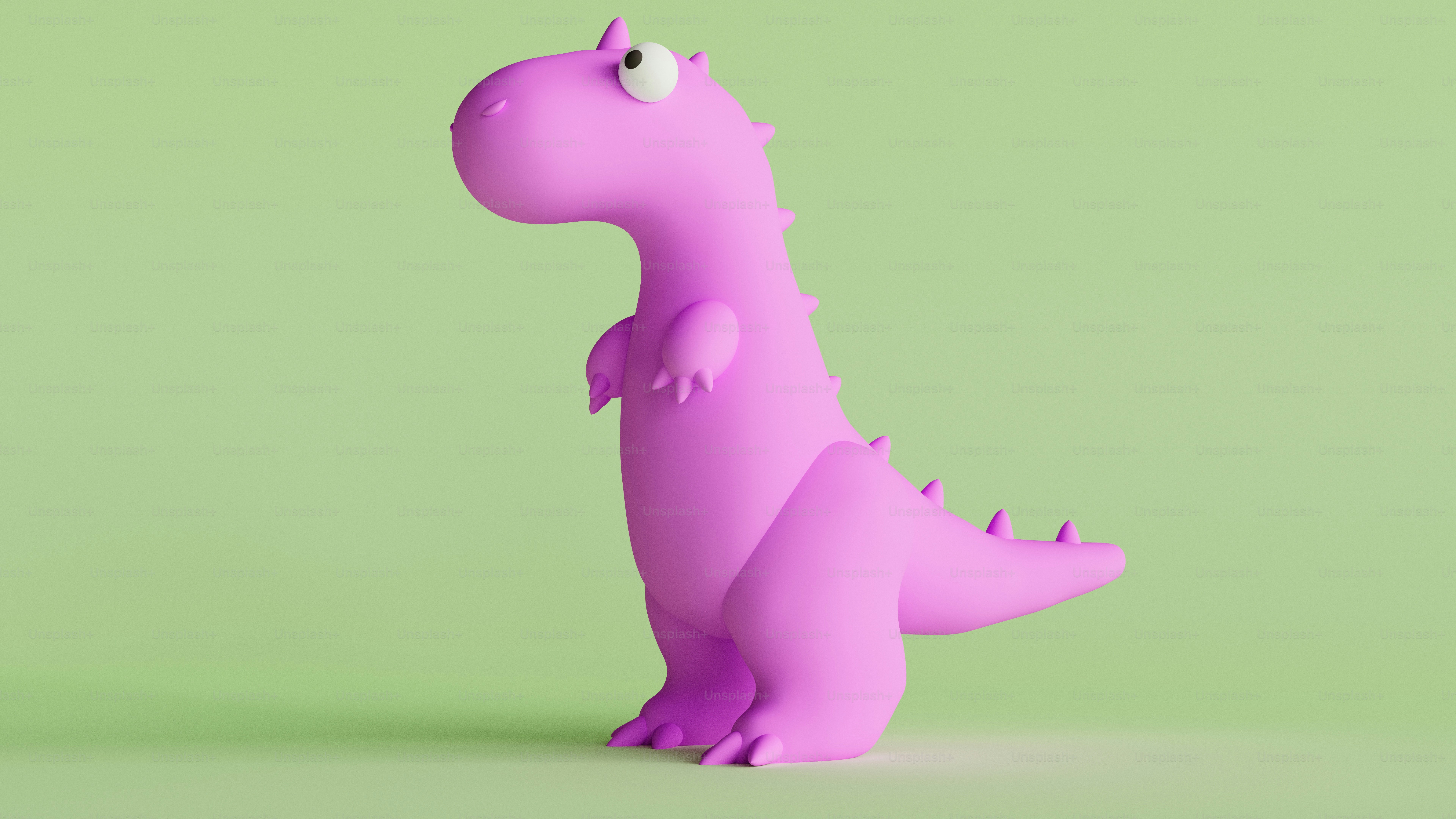 Un lindo dinosaurio rosa se encuentra sobre un fondo verde. foto ...