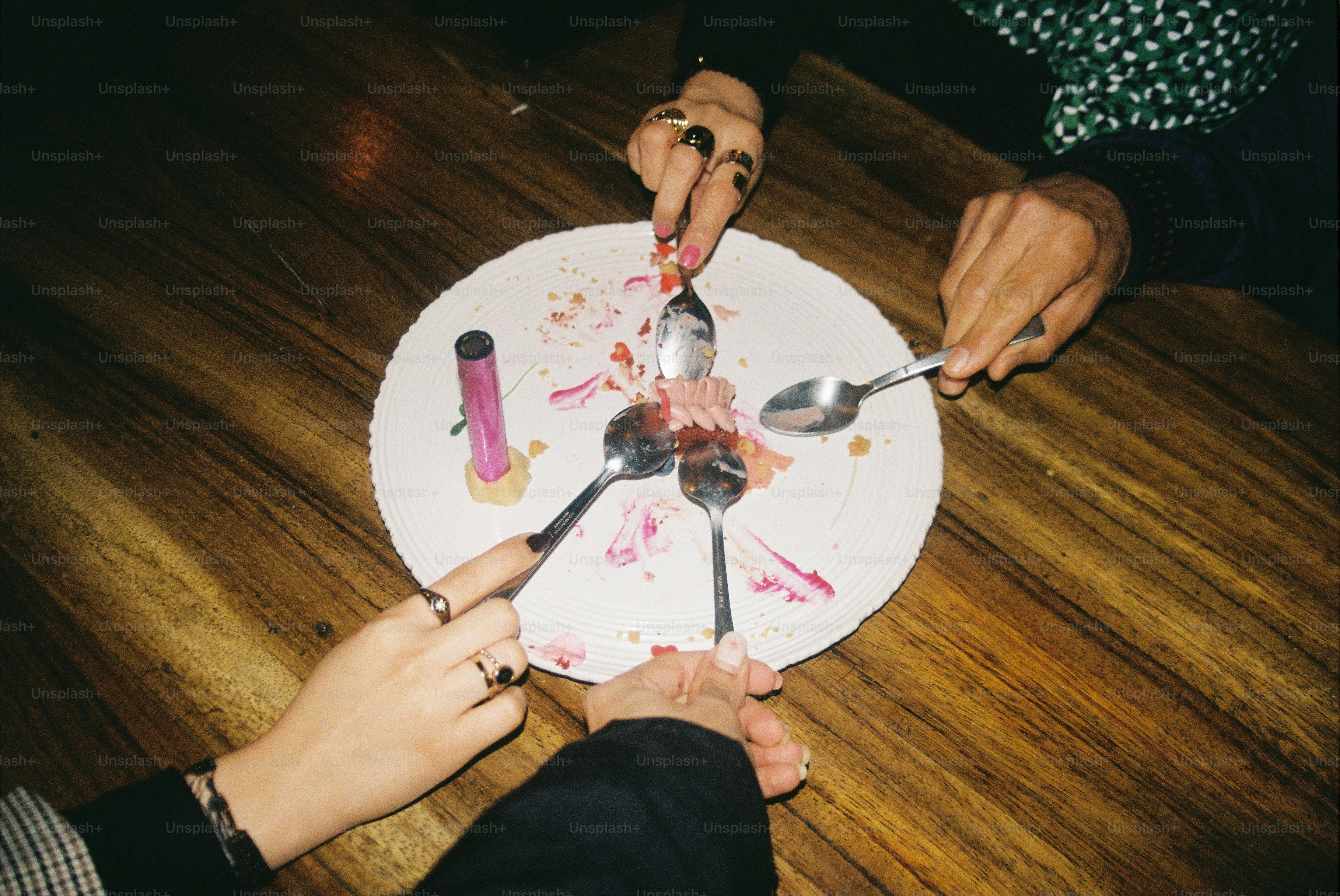 People eating dessert with spoons on a plate. photo – Photography Image ...