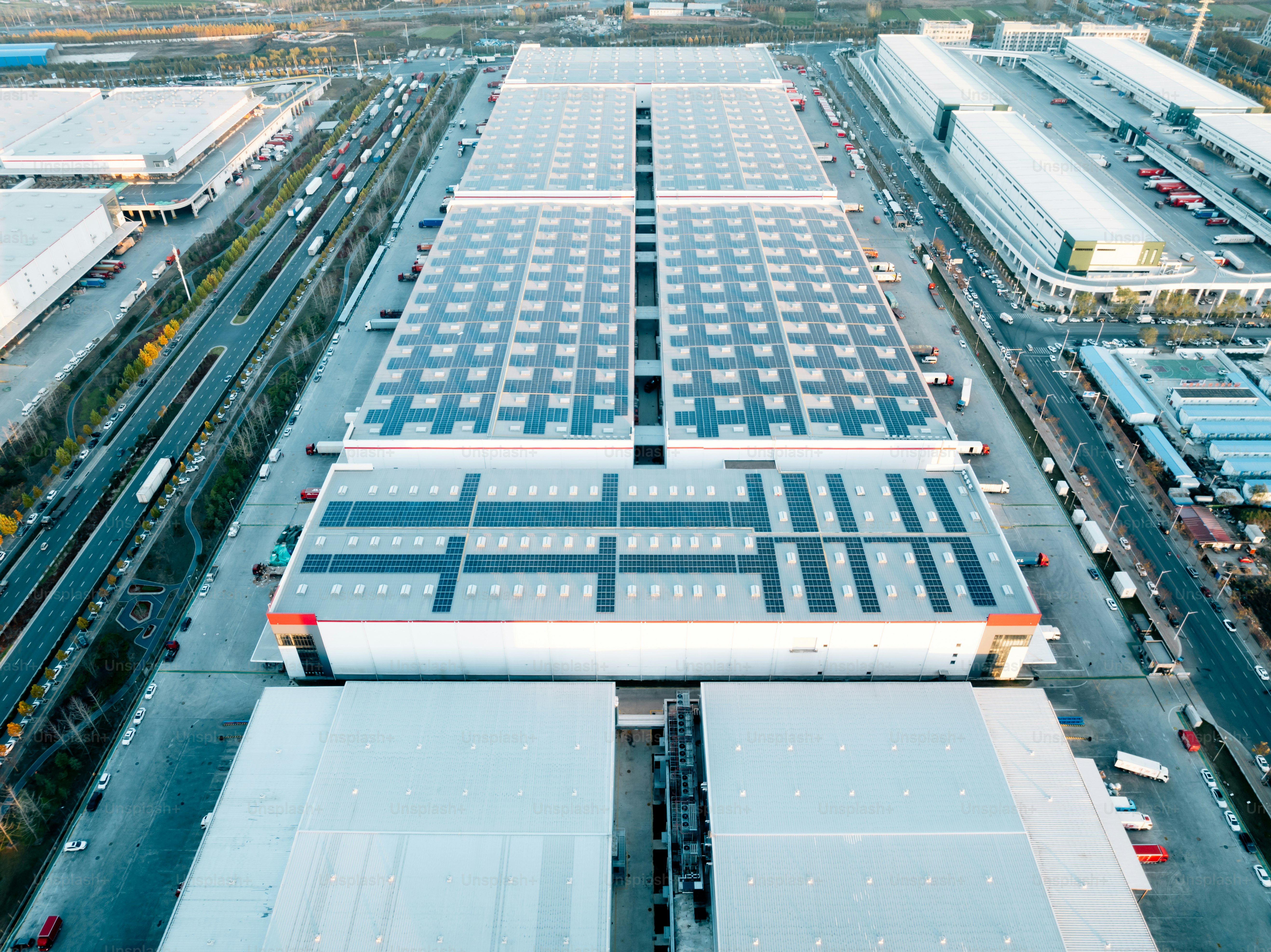 Aerial view of a factory with rooftop solar power photo – Technology ...