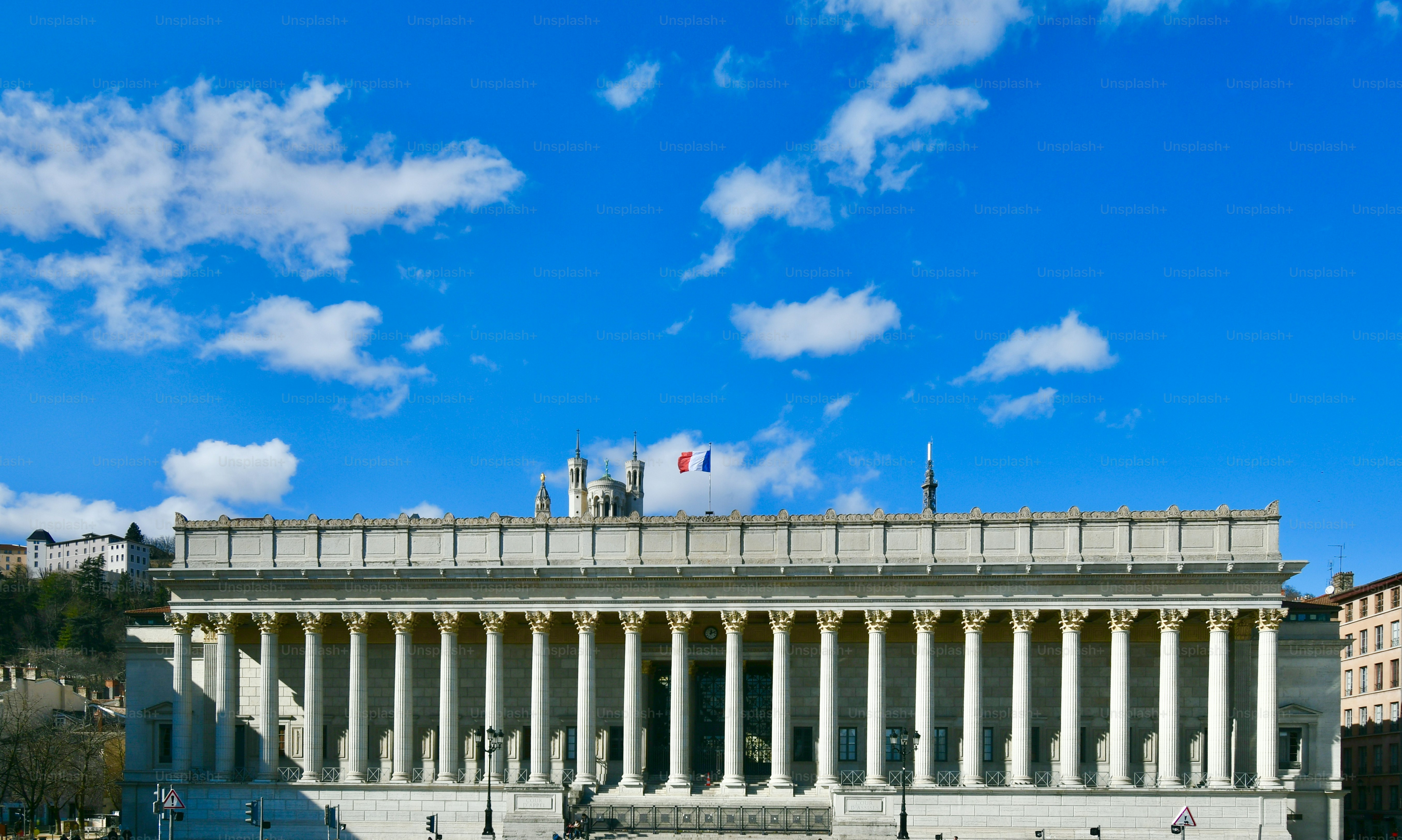 Famous Lyon tribunal court with basilica our lady of fourvière at the ...
