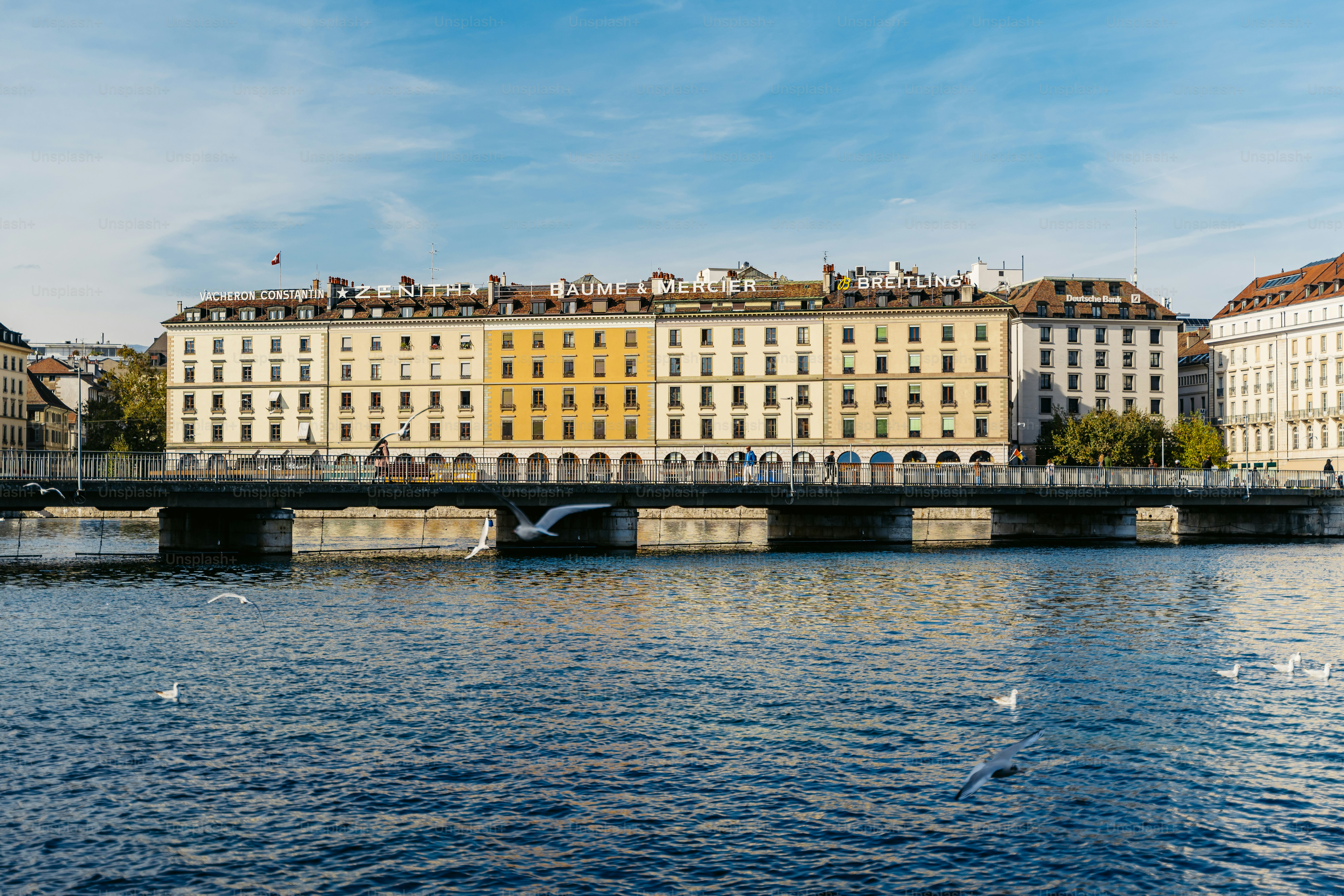 Buildings of famous brands on Bergues quay of Rhone river in Geneva ...