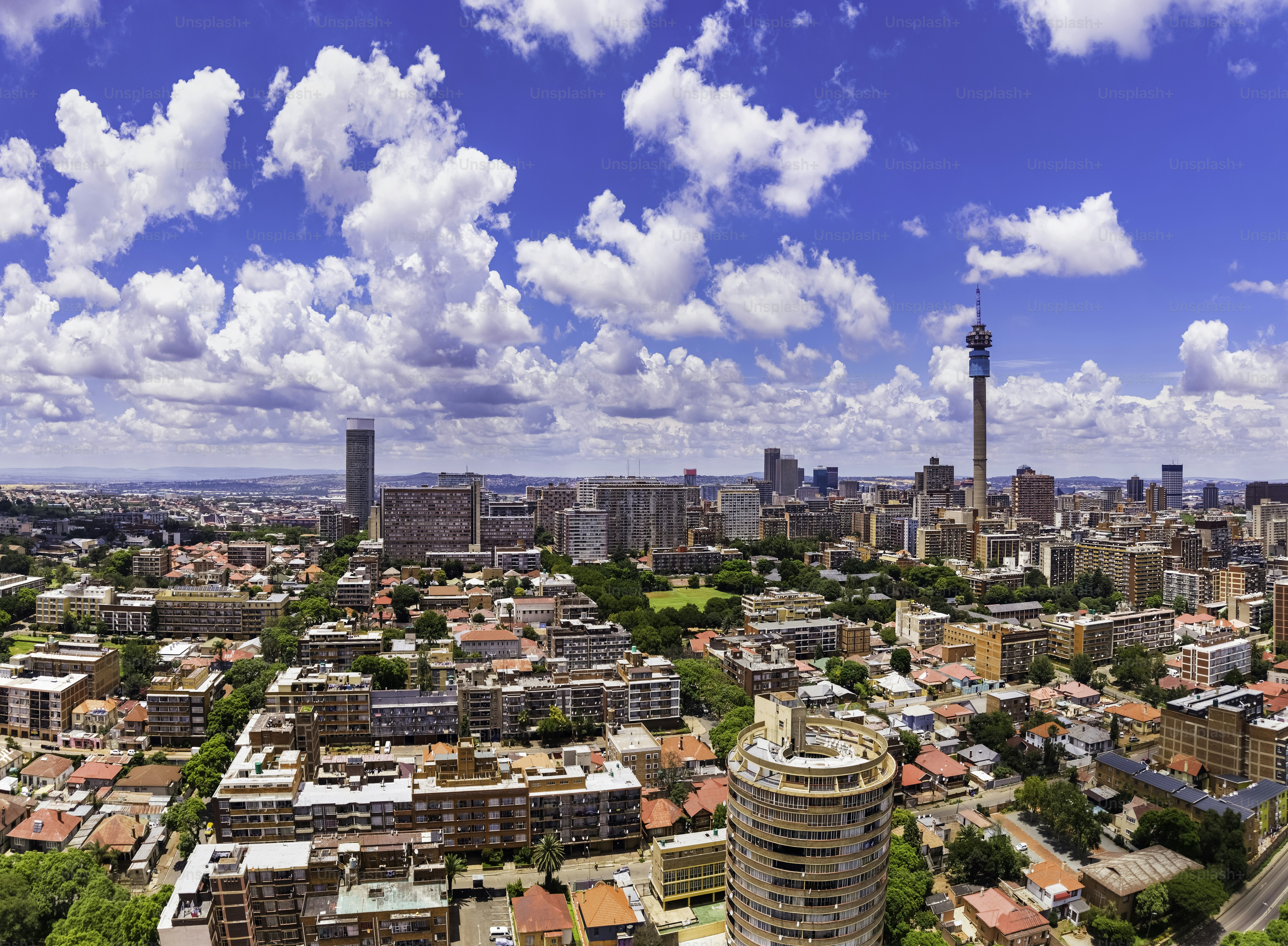 Johannesburg cityscape under fast moving clouds. Johannesburg is one of ...