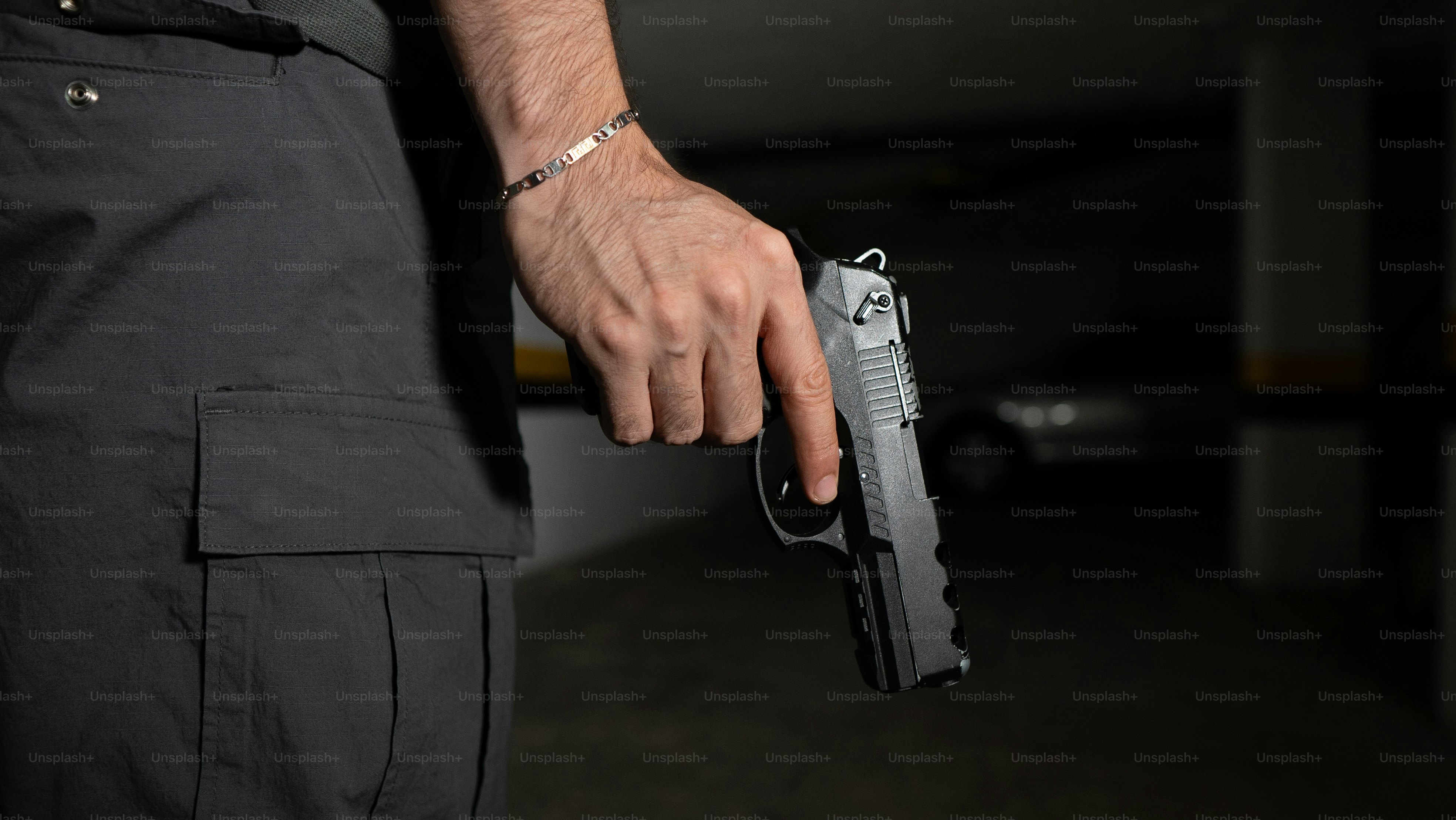 Man carrying a gun down photo – People Image on Unsplash