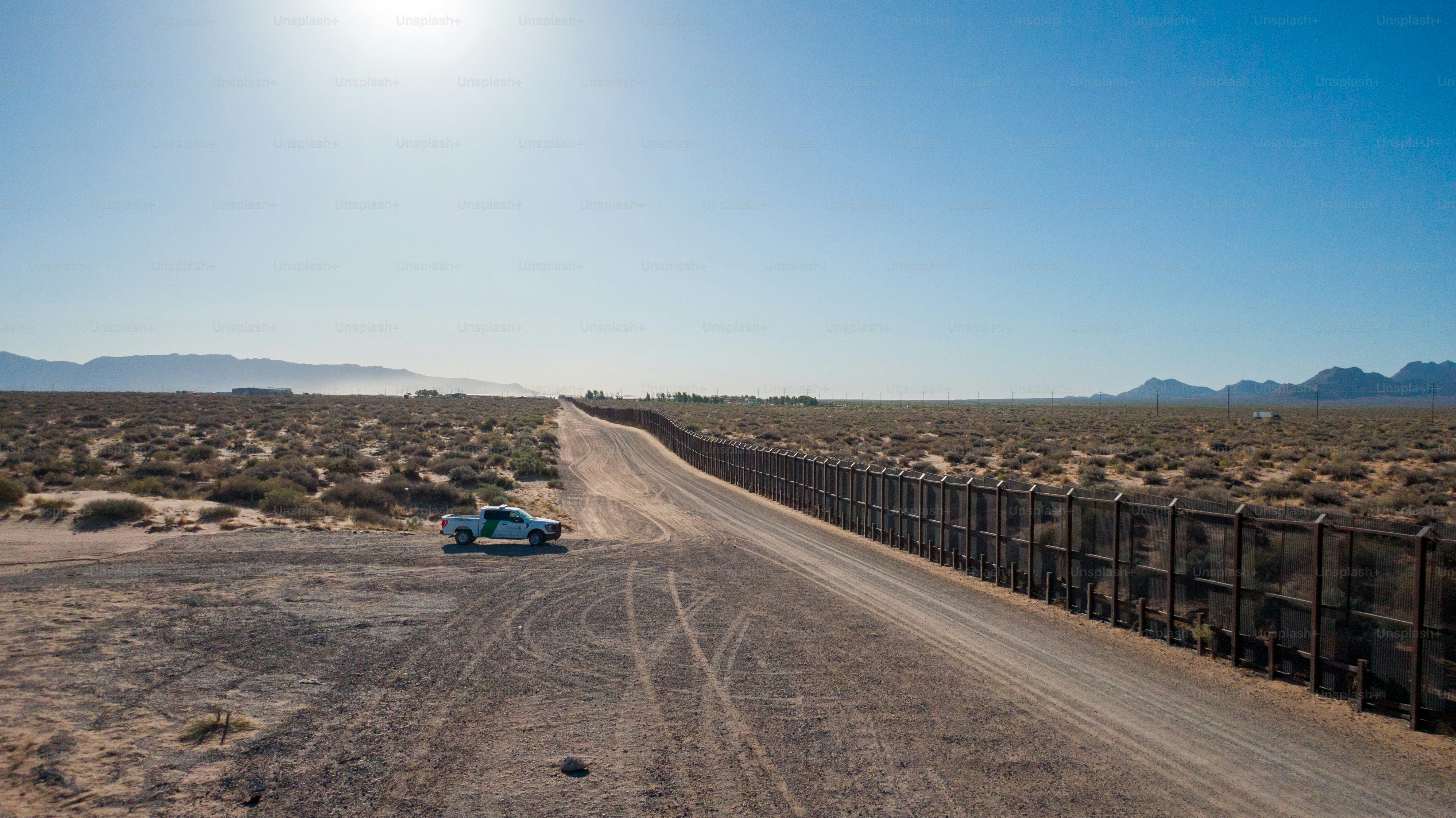 A Border Patrol Vehicle Parked, Stands Watch at the Mexican American ...