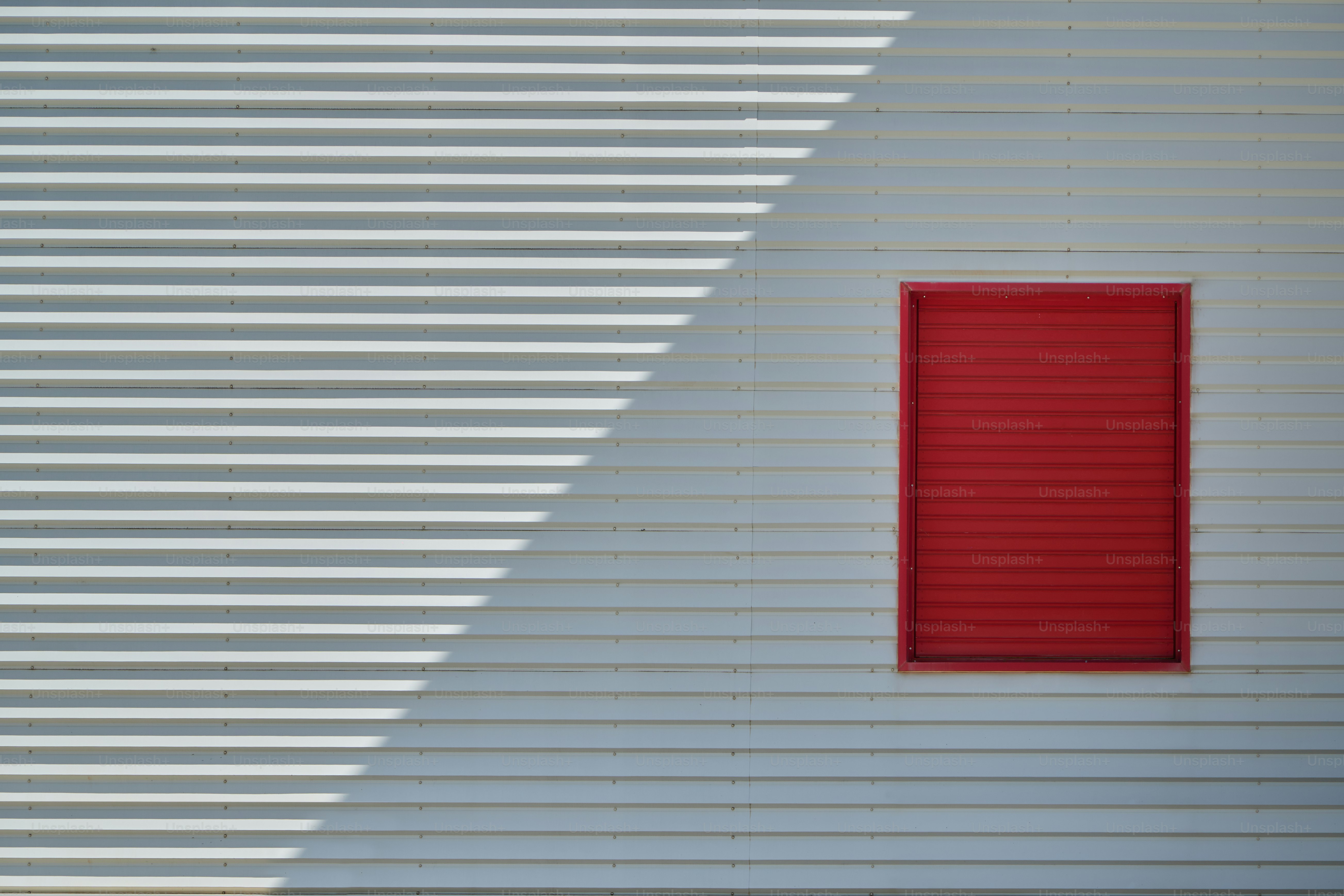 Shade and sunlight on urban factory wall with window photo – Business ...