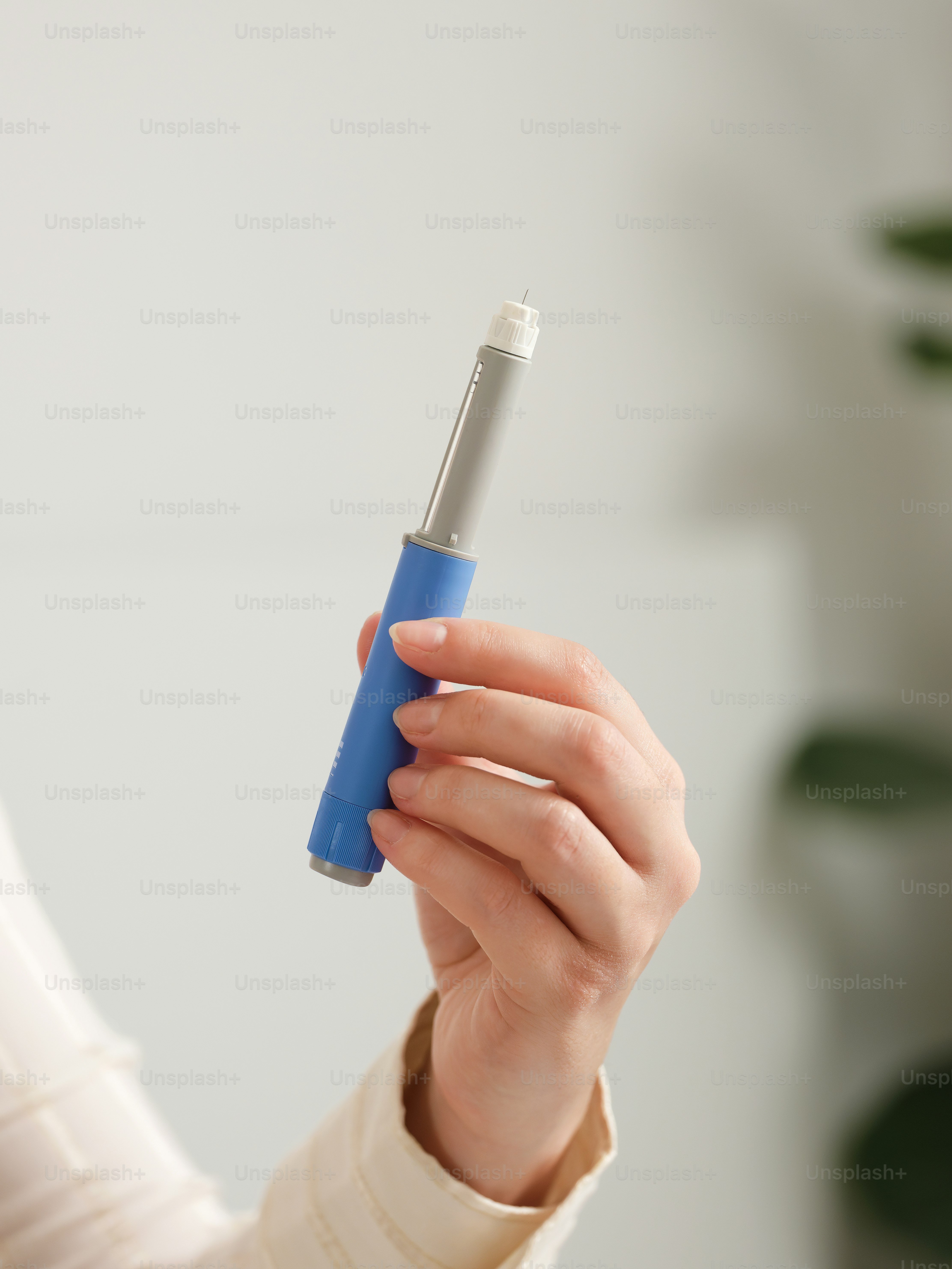 Close-up of woman's hand holding semaglutide injection pen. photo ...