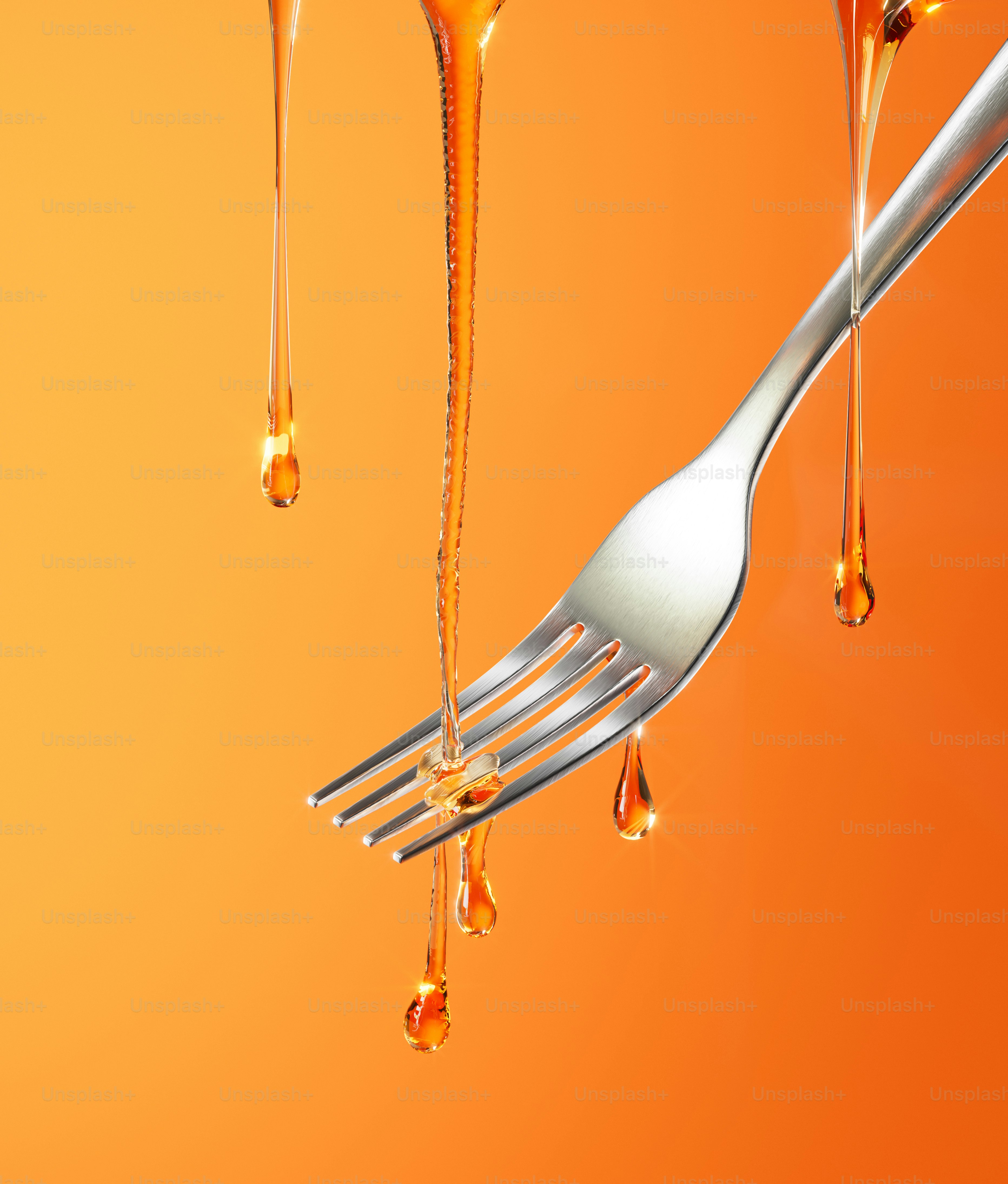 Syrup drips from a fork against an orange background. photo – 3d render ...