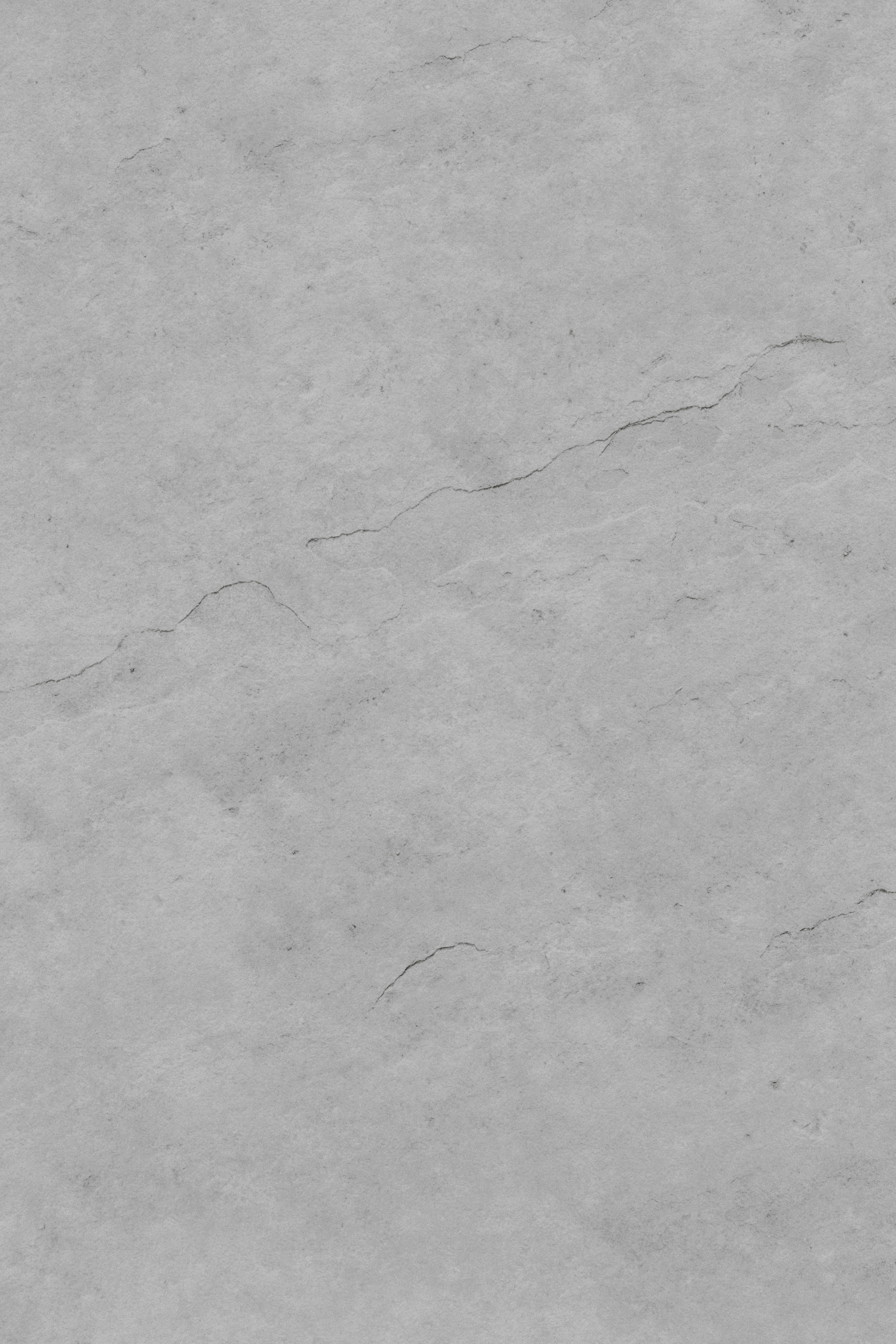 A gray stone surface with some cracks. photo – Wallpaper Image on Unsplash