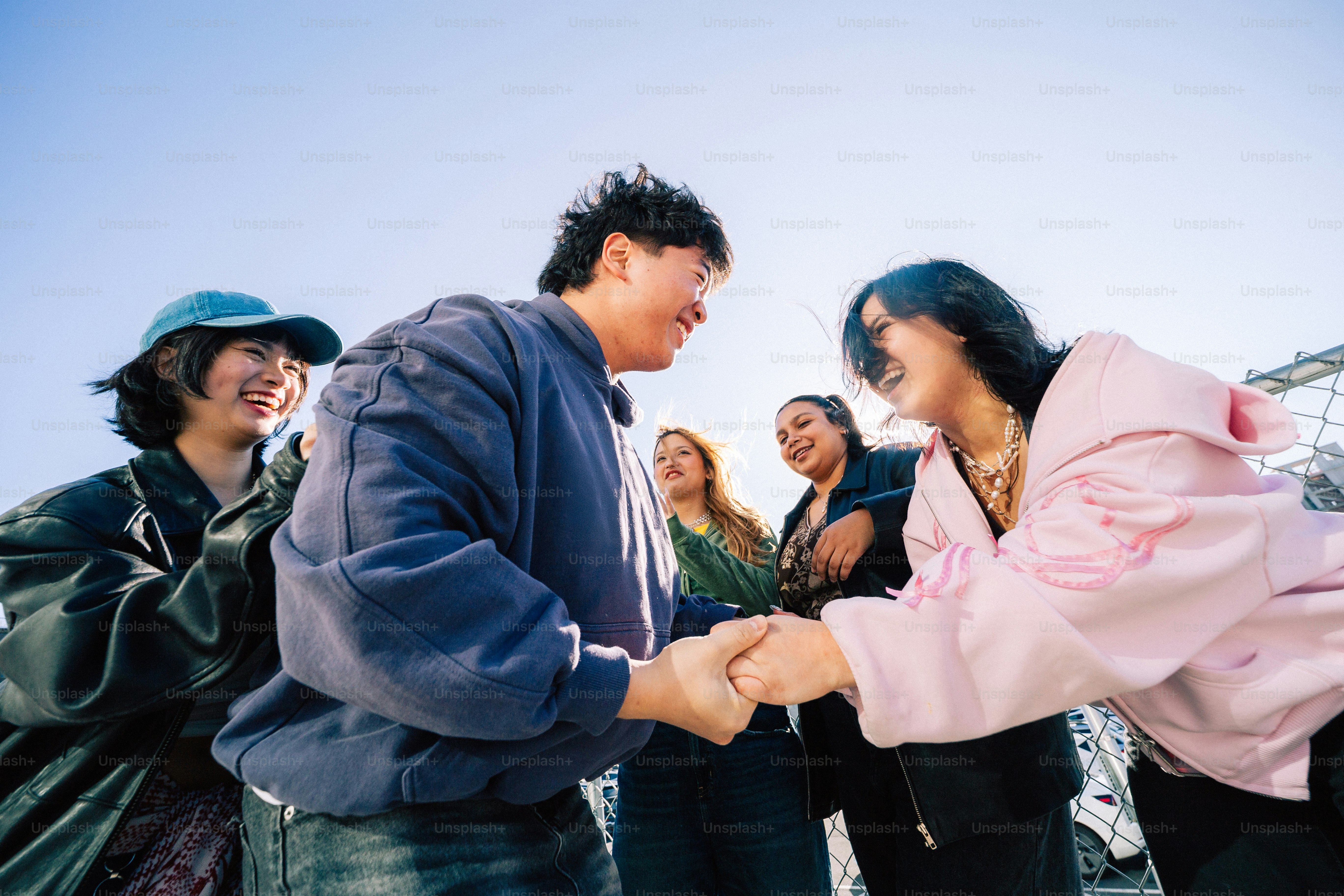 People shaking hands and smiling happily together. photo – New york ...