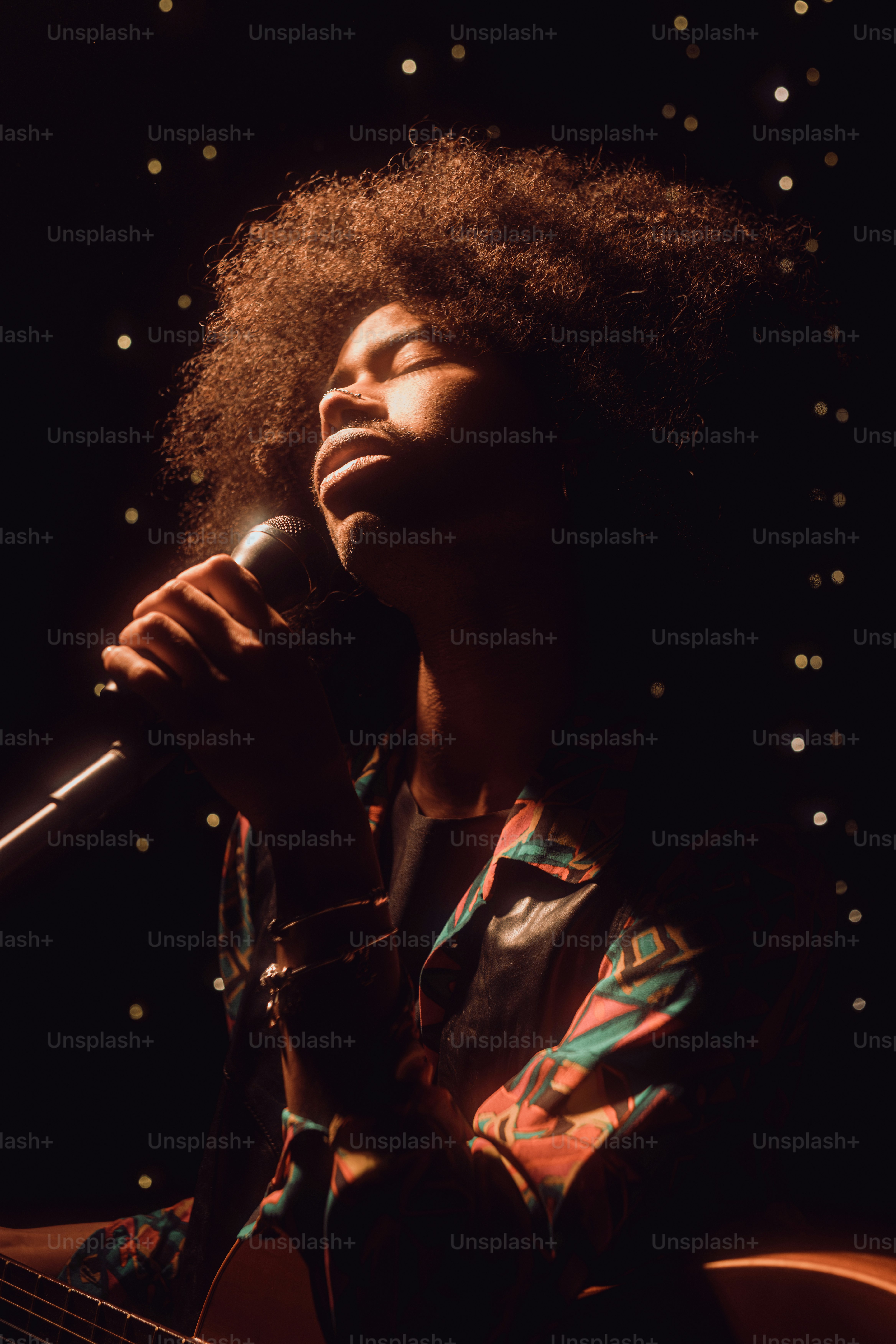 Singer performs on stage, surrounded by fans. photo – Music Image on ...