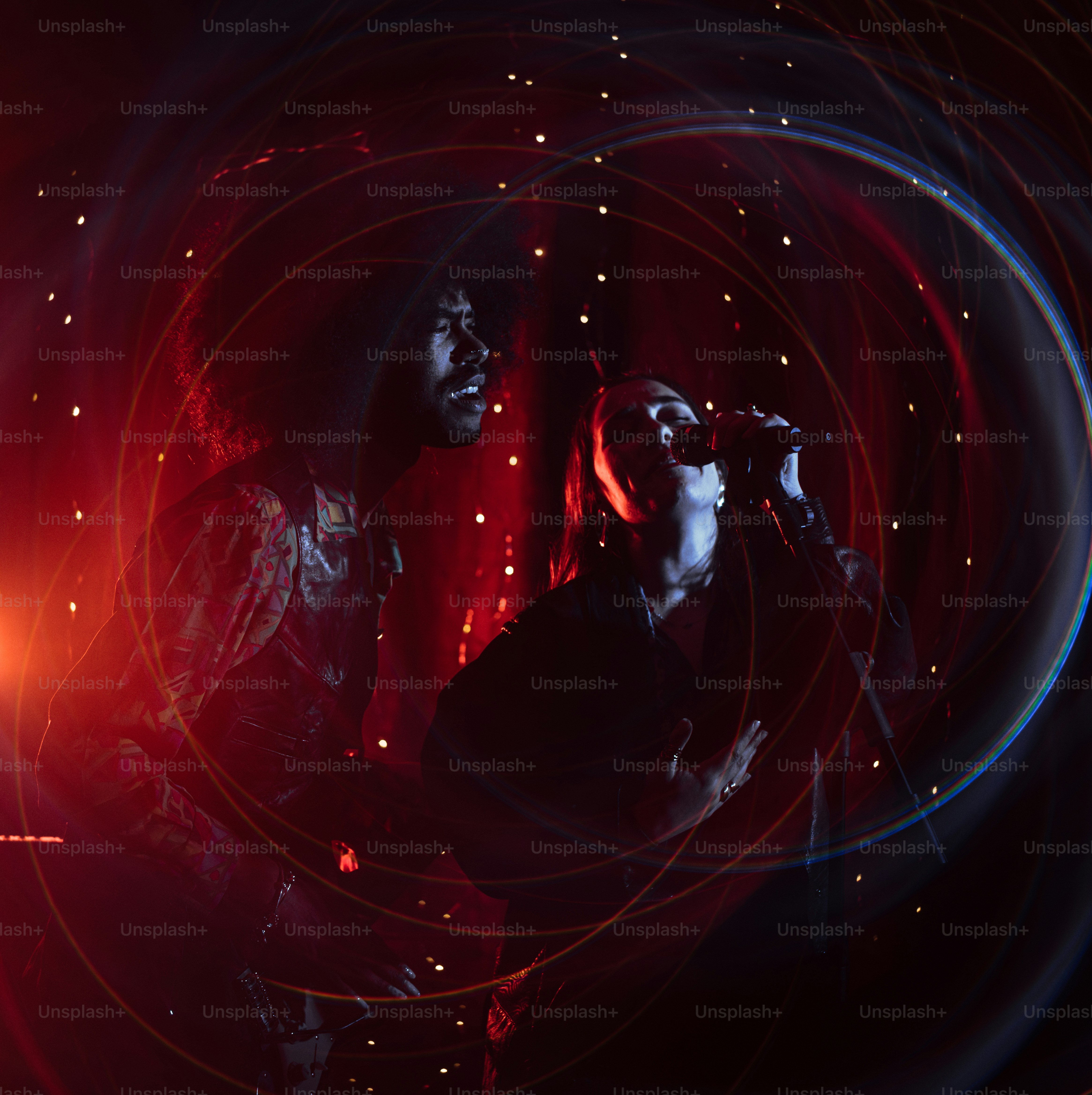 Singers perform on stage with lights. photo – Music Image on Unsplash