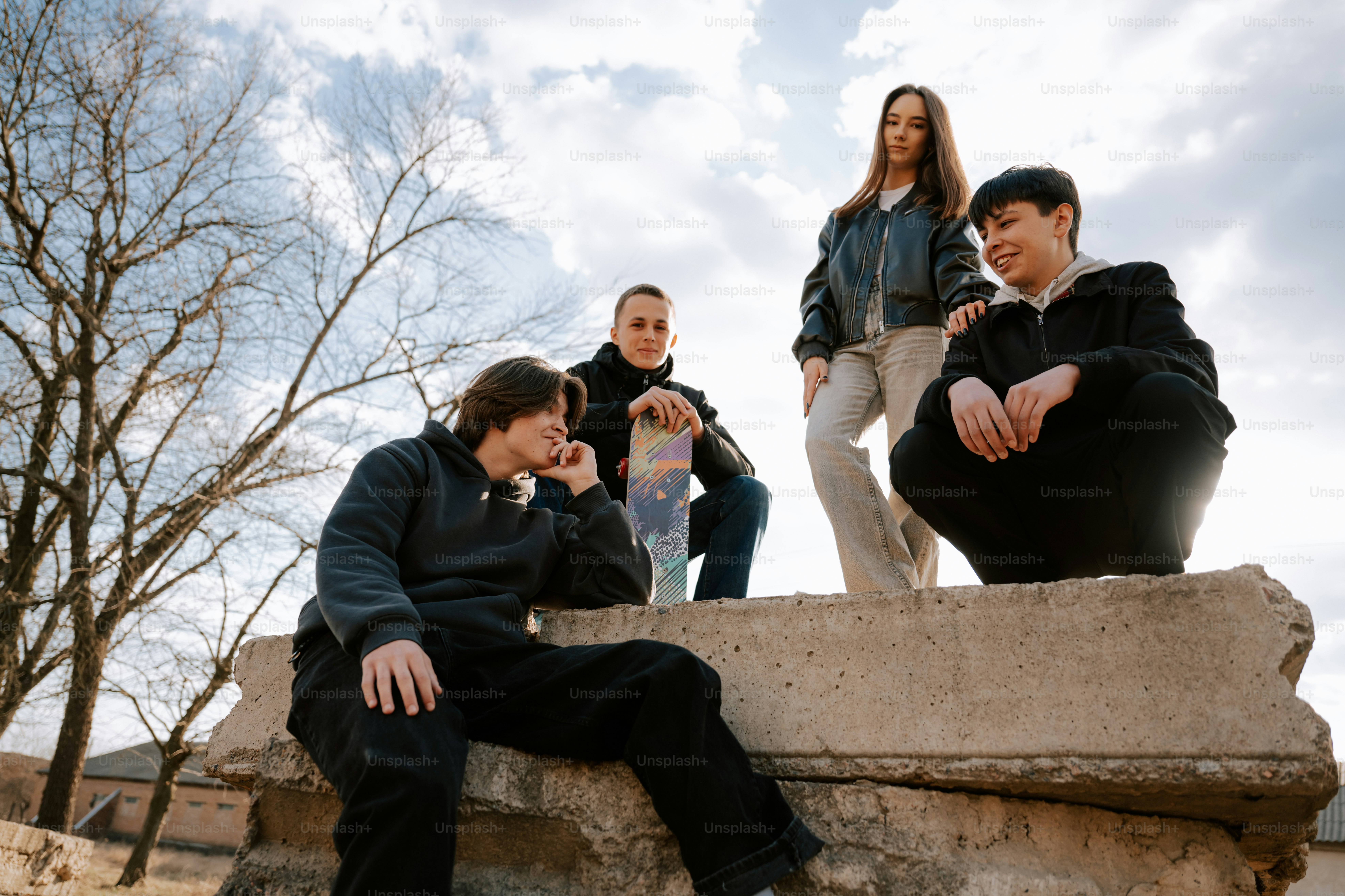 A group of friends hangs out outdoors together. photo – Diversity Image ...