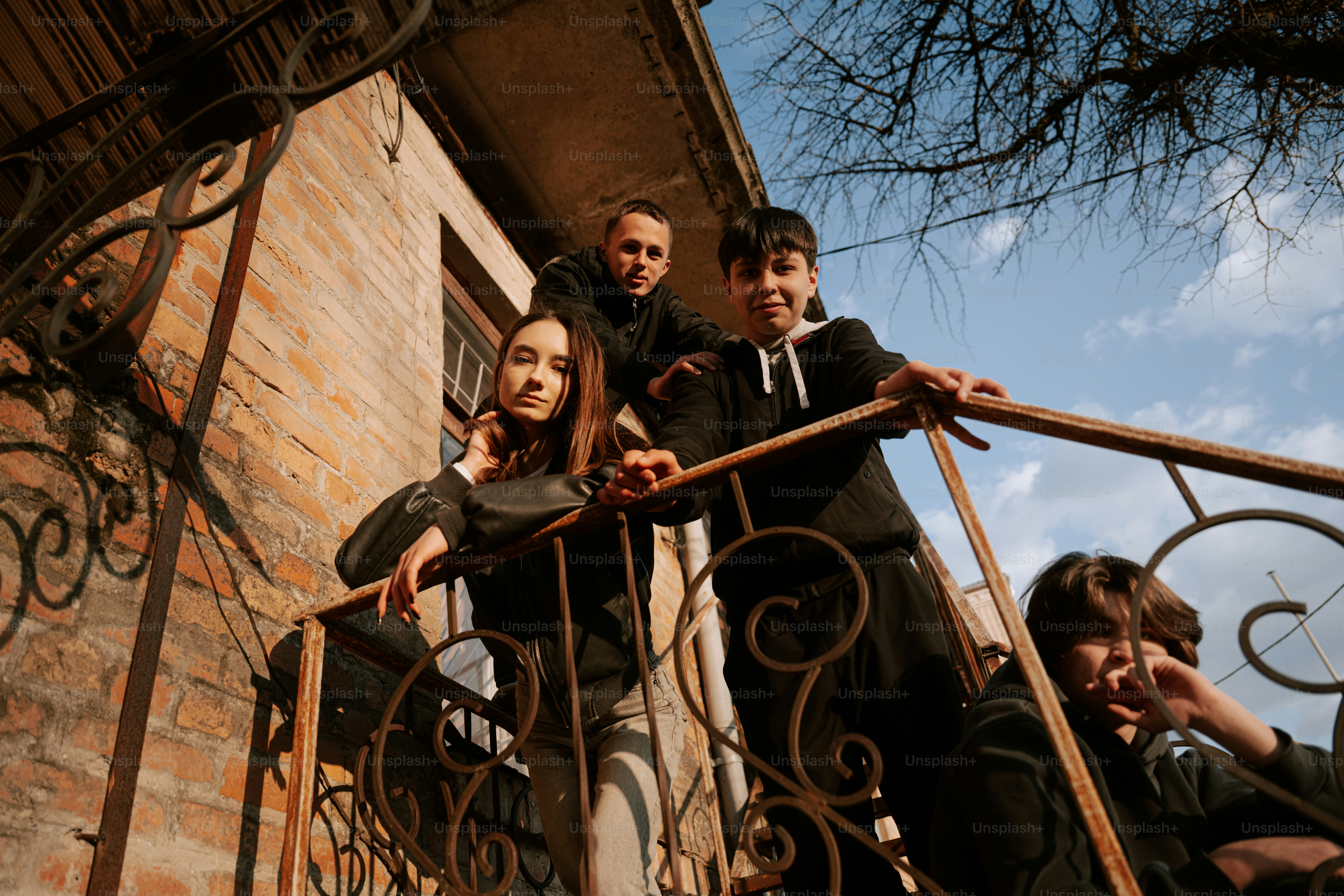 Group of young people standing on a balcony. photo – Diversity Image on ...