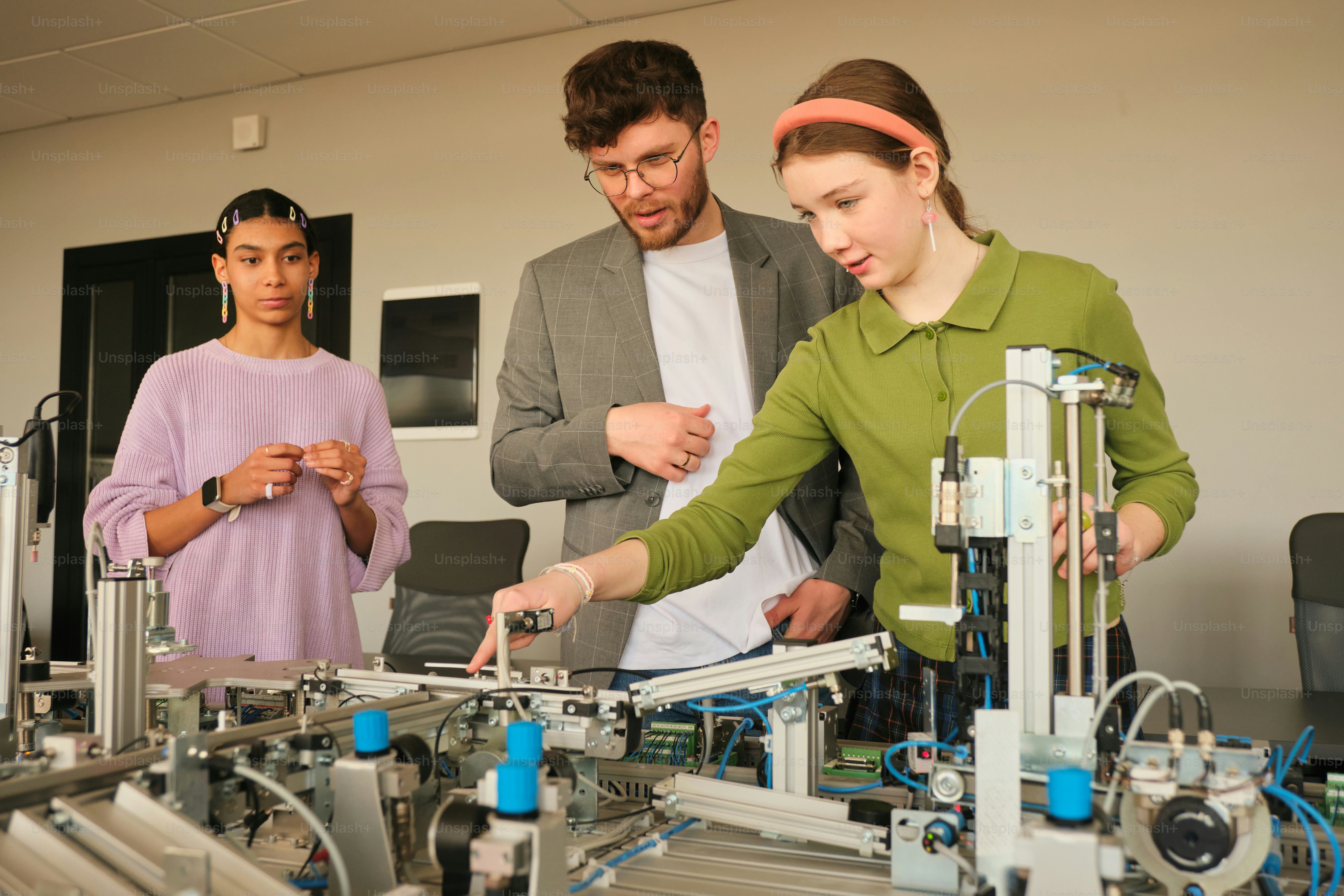 Students work on an engineering project in the classroom. photo ...