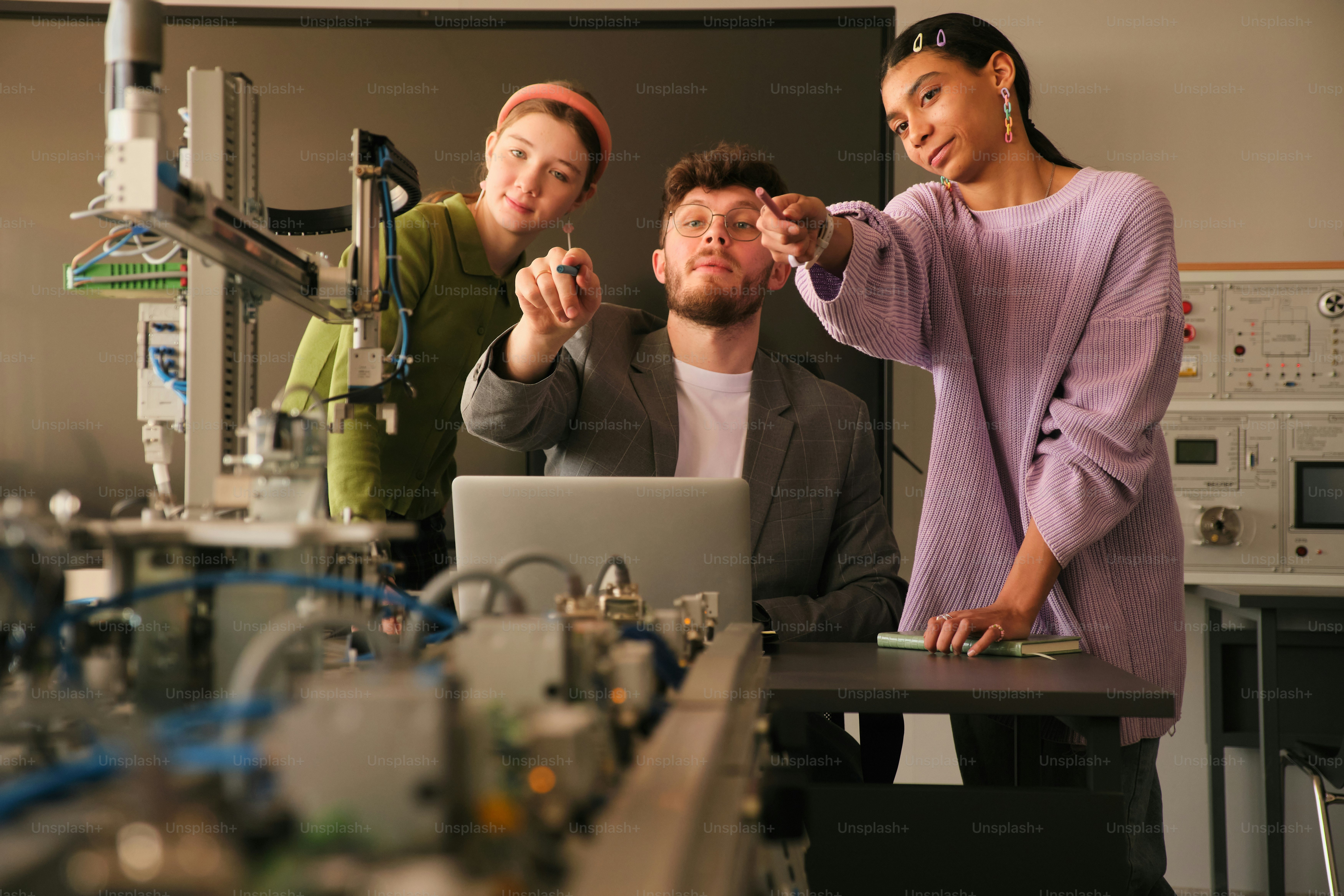 Students are working on a robotics project together. photo – Technology ...