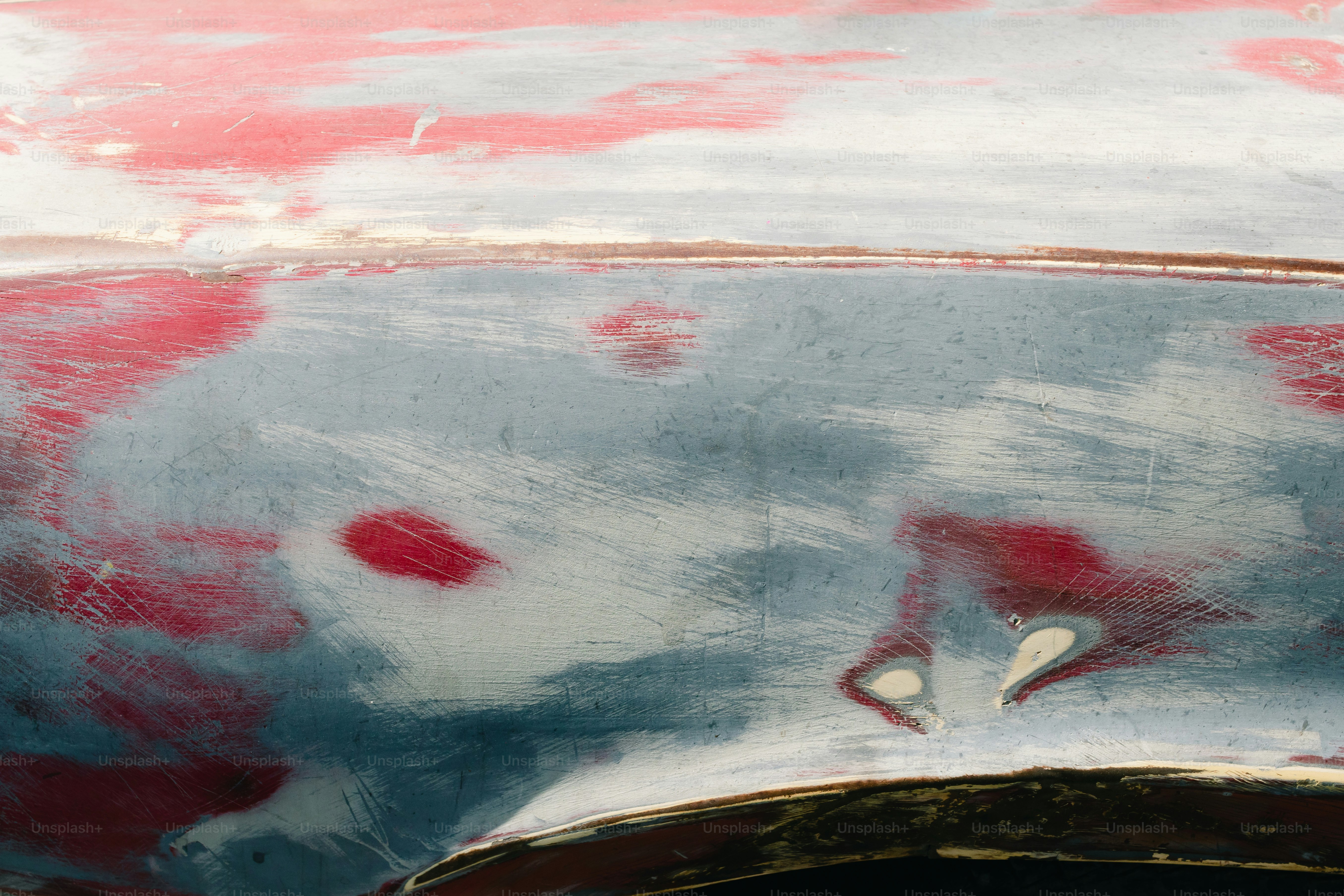 A car body undergoing a paint job. photo – Texture Image on Unsplash