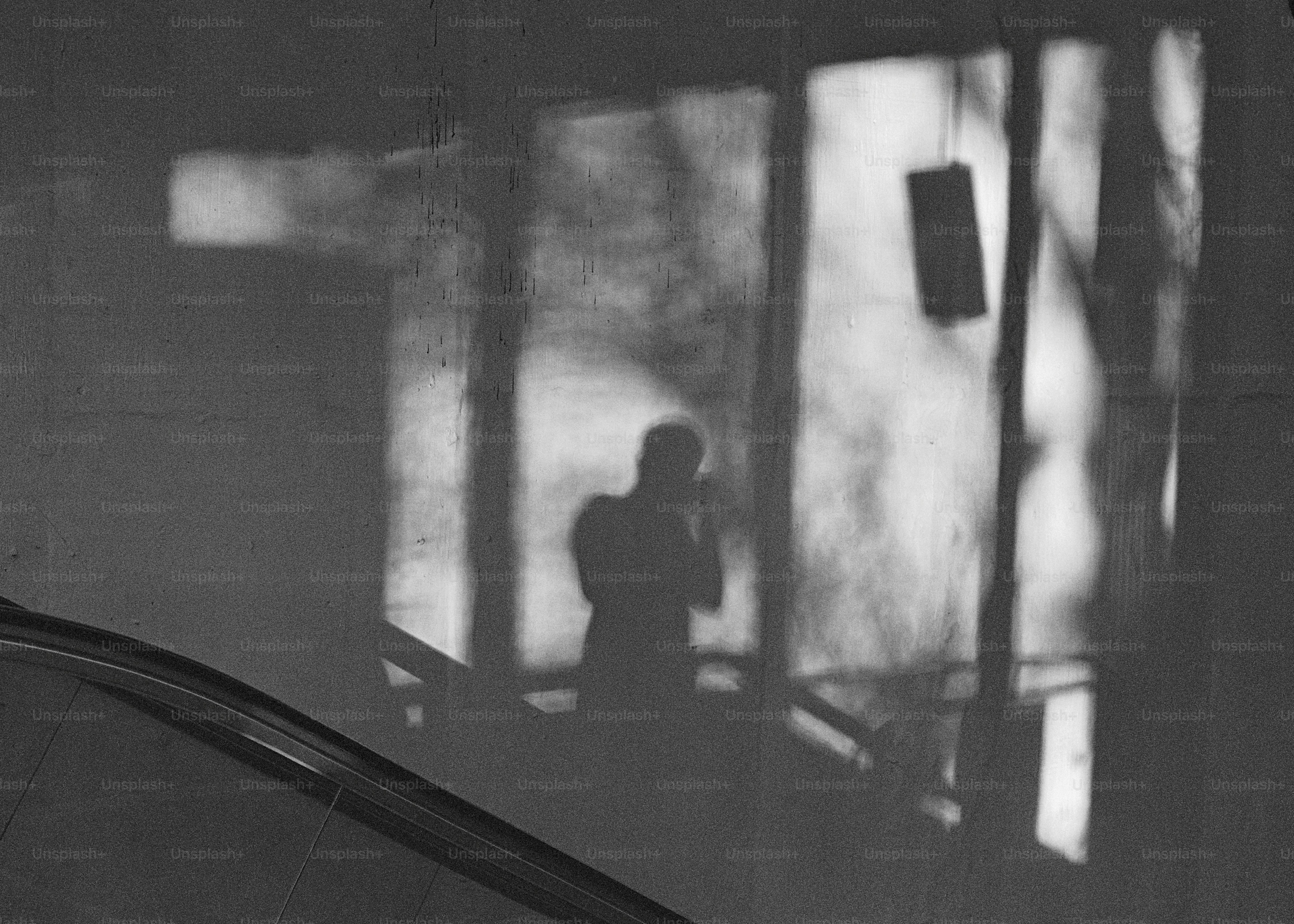 A silhouetted person stands in a window's shadow. photo – Photography ...