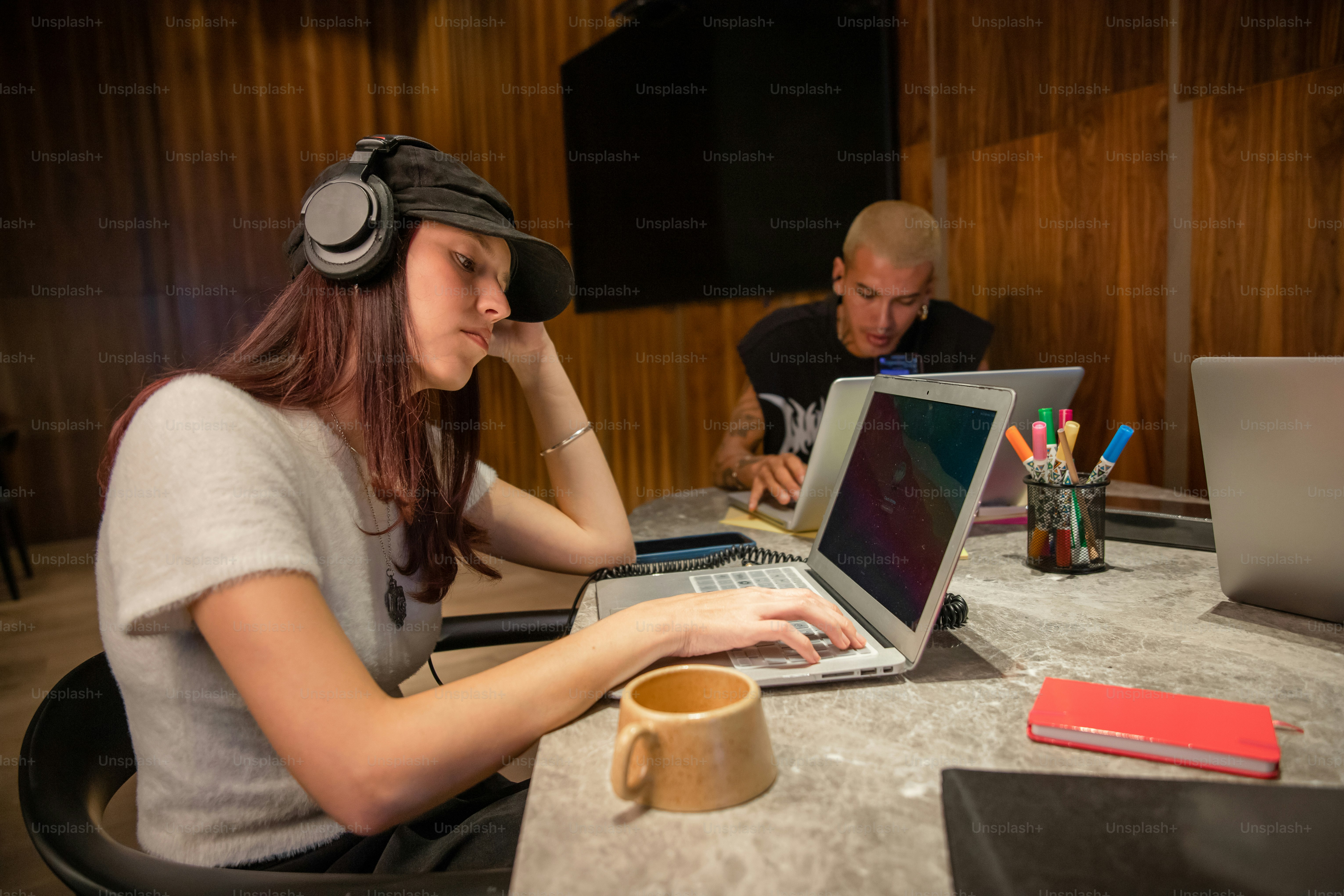 Two people work at computers in an office. photo – Working Image on ...
