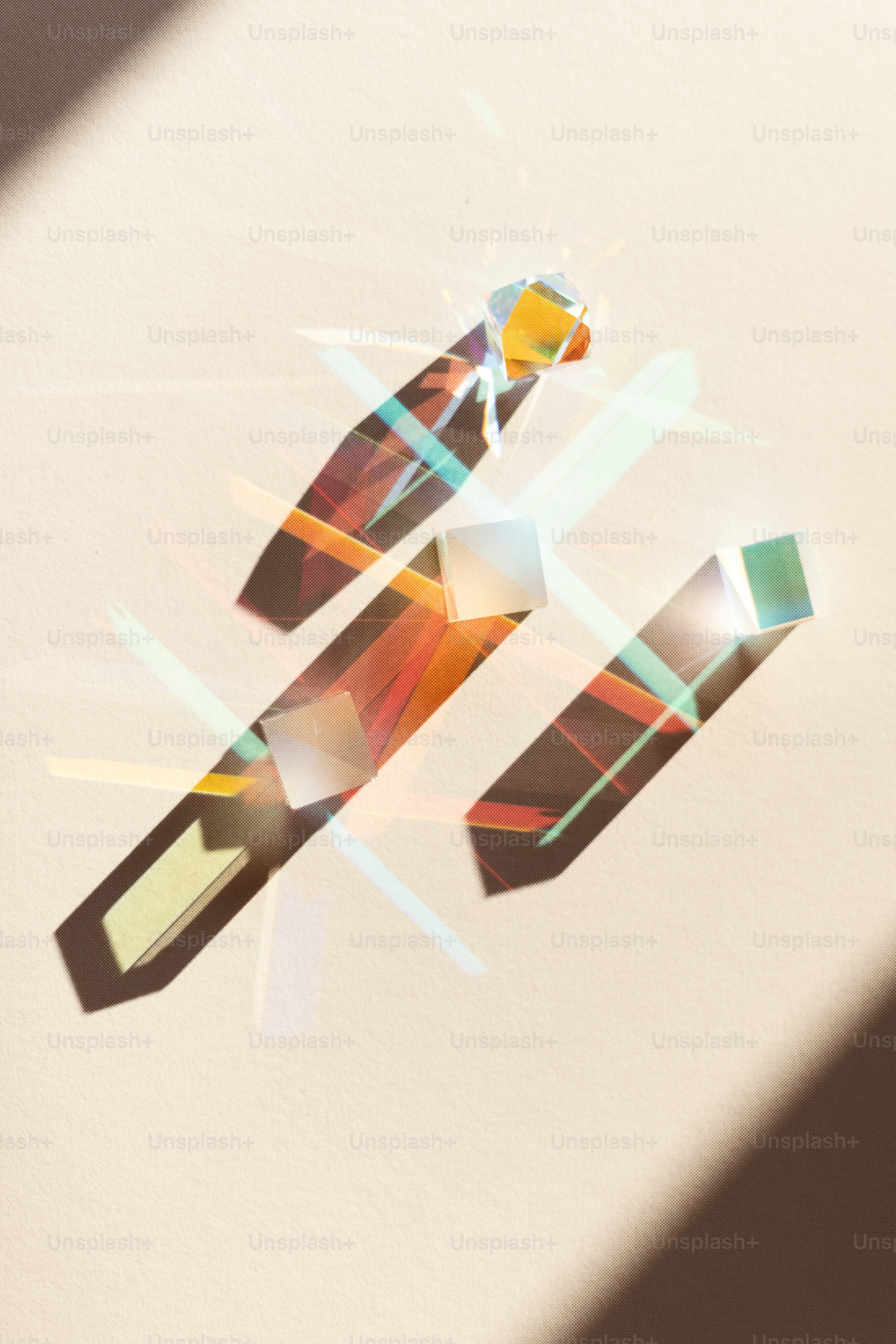 Colorful prisms create refracted light patterns. photo – Wallpaper Image on Unsplash