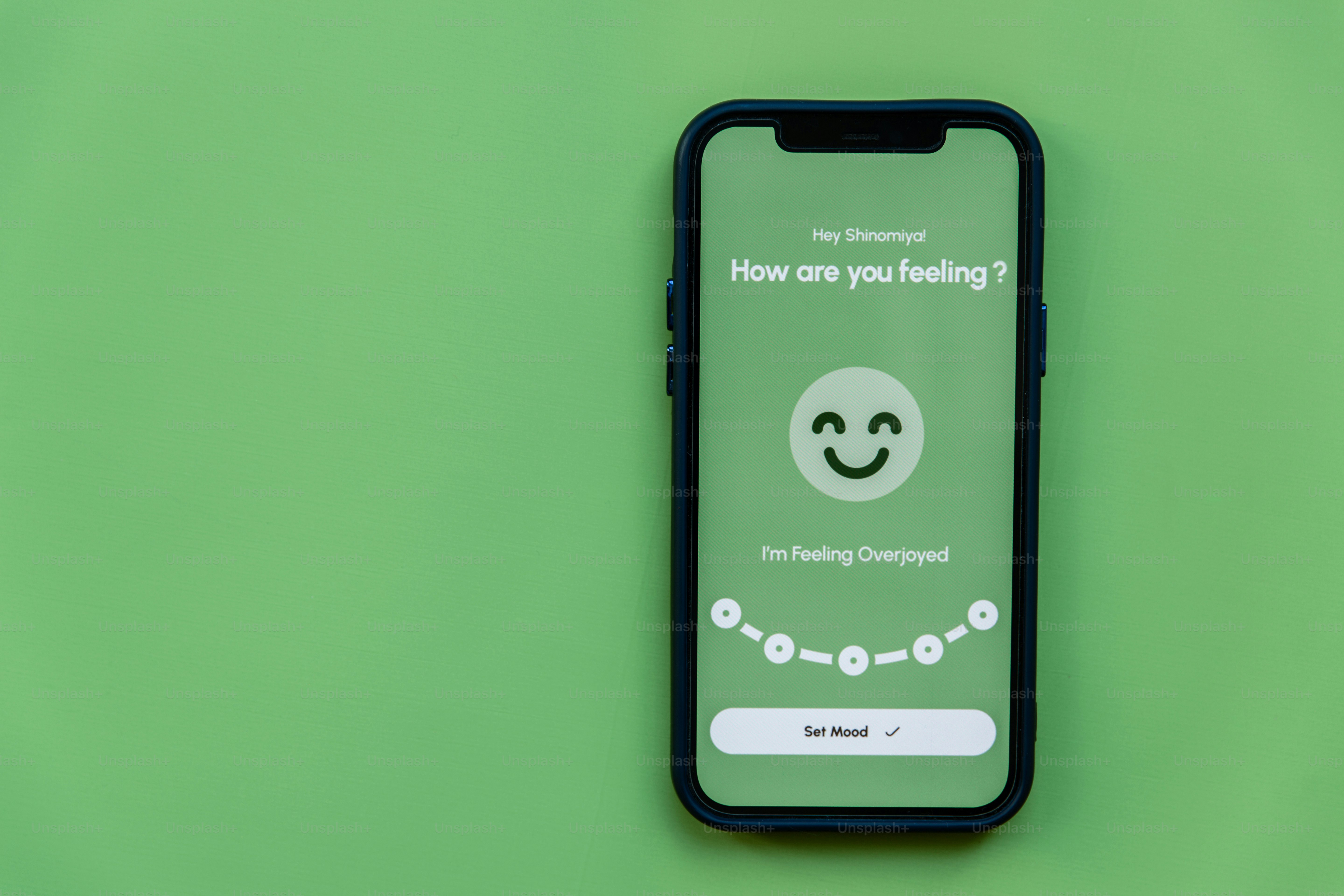 A phone displays a happiness check-in. photo – Tech Image on Unsplash